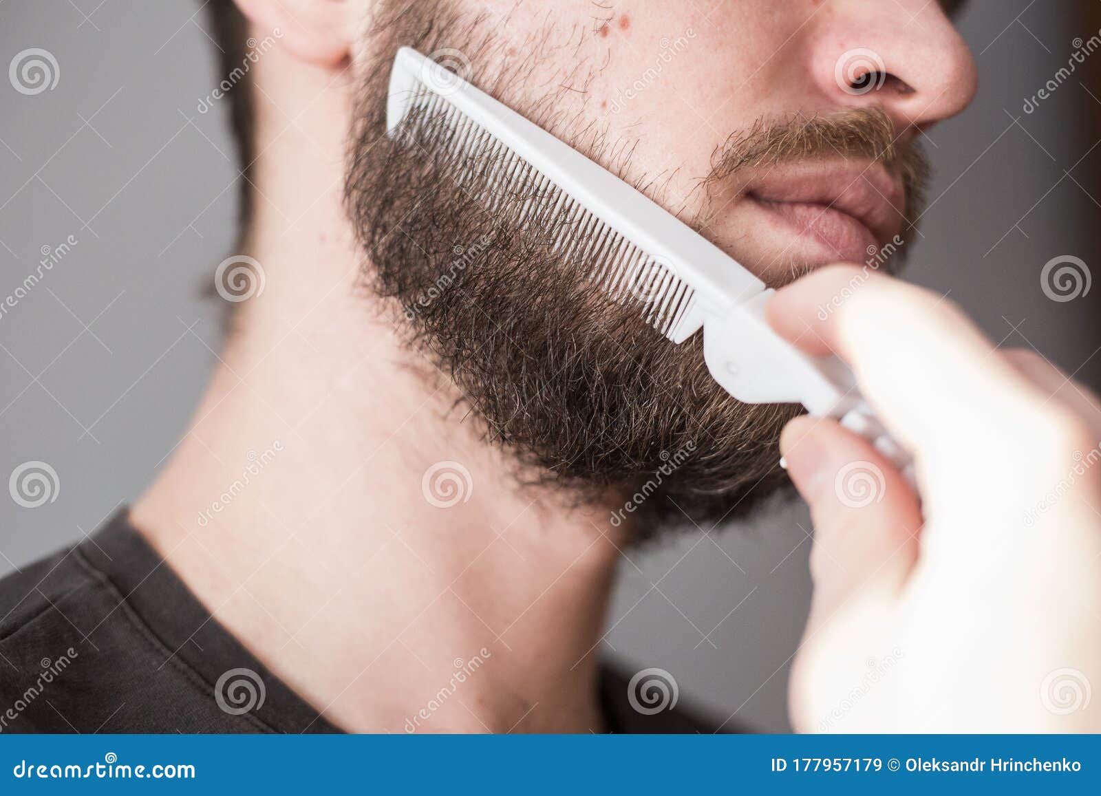 A Man Combing His Beard with a Comb Stock Image - Image of electric ...