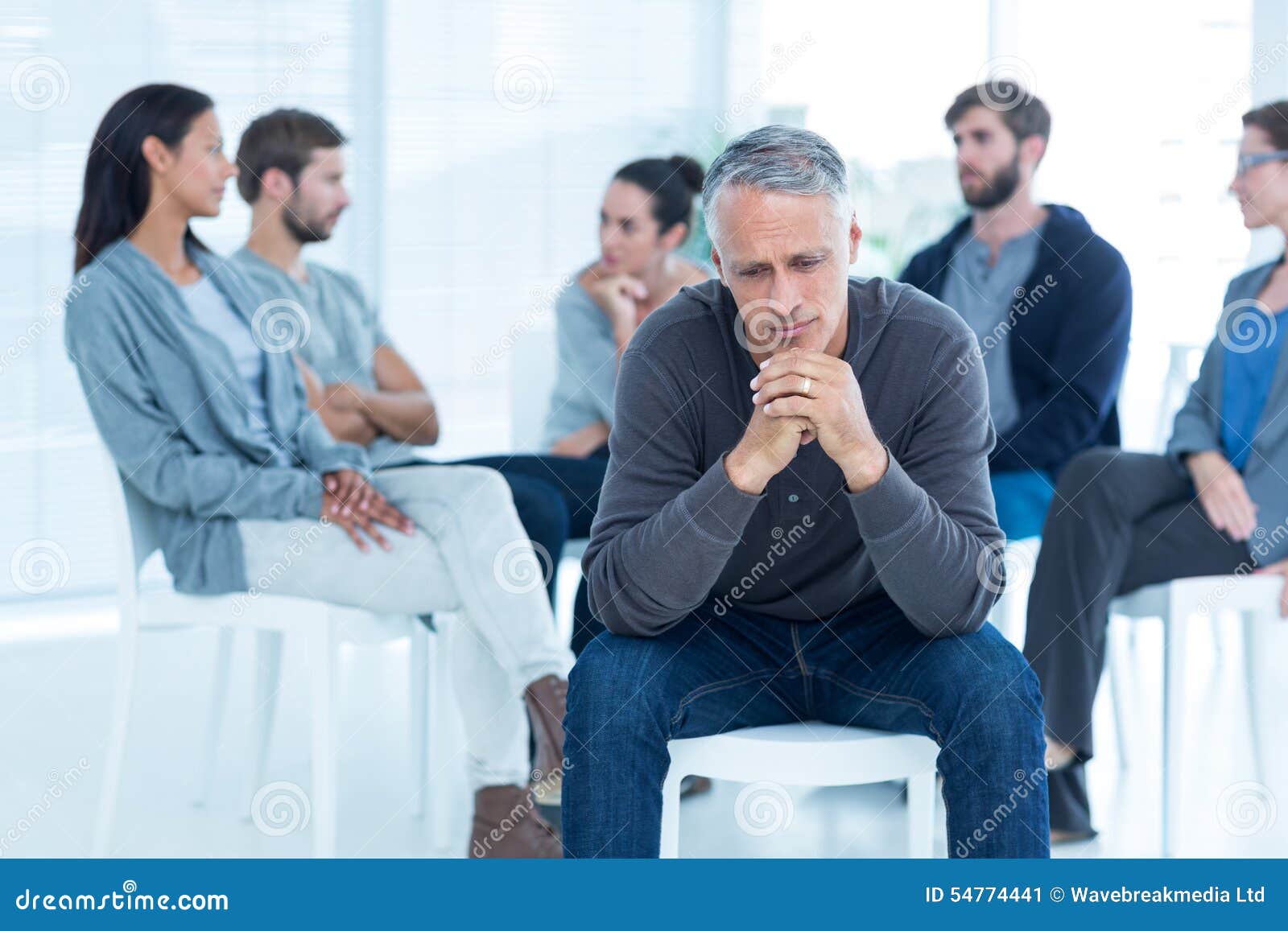 Man Comforting Another in Rehab Group at Therapy Stock Image - Image of ...