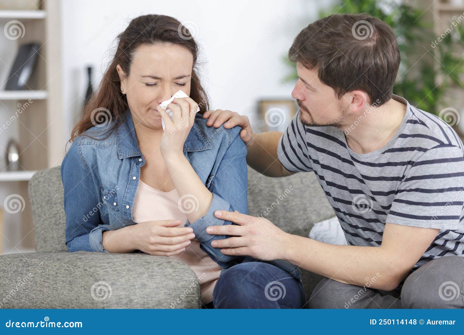 Man Comforting Woman Crying on Sofa Stock Photo - Image of indoor ...