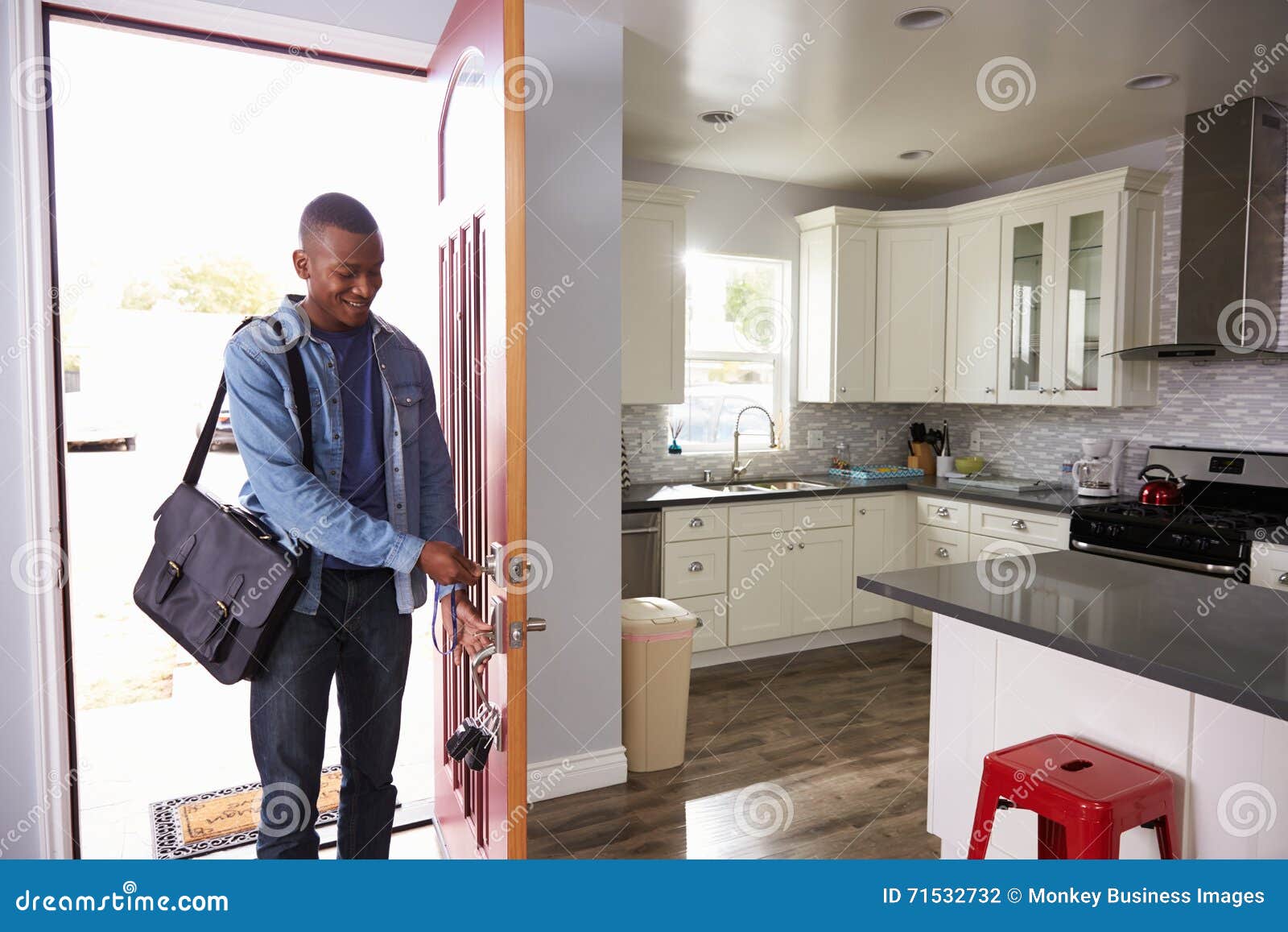 Man Coming Home from Work and Opening Door of Apartment Stock Photo ...