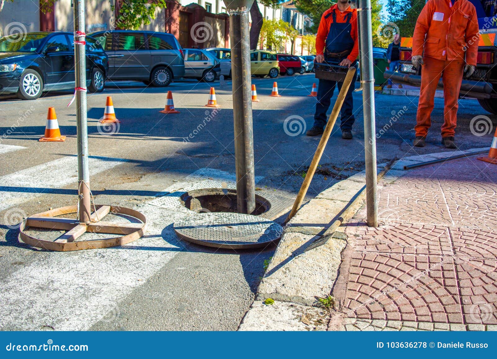 A Man is Commanding a Machine for Cleaning the Manholes in the S Stock ...