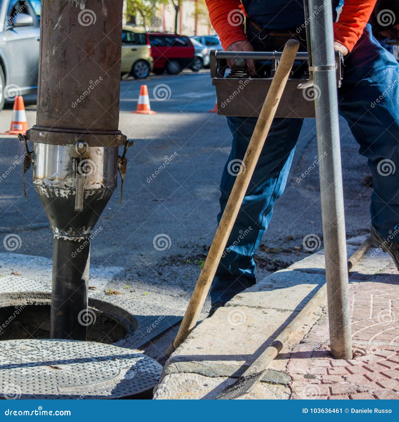 A Man is Commanding a Machine for Cleaning the Manholes in the S Stock ...