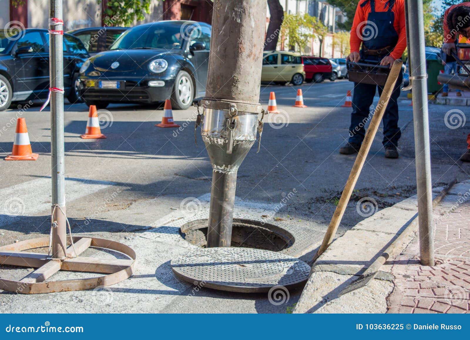 A Man is Commanding a Machine for Cleaning the Manholes in the S Stock ...