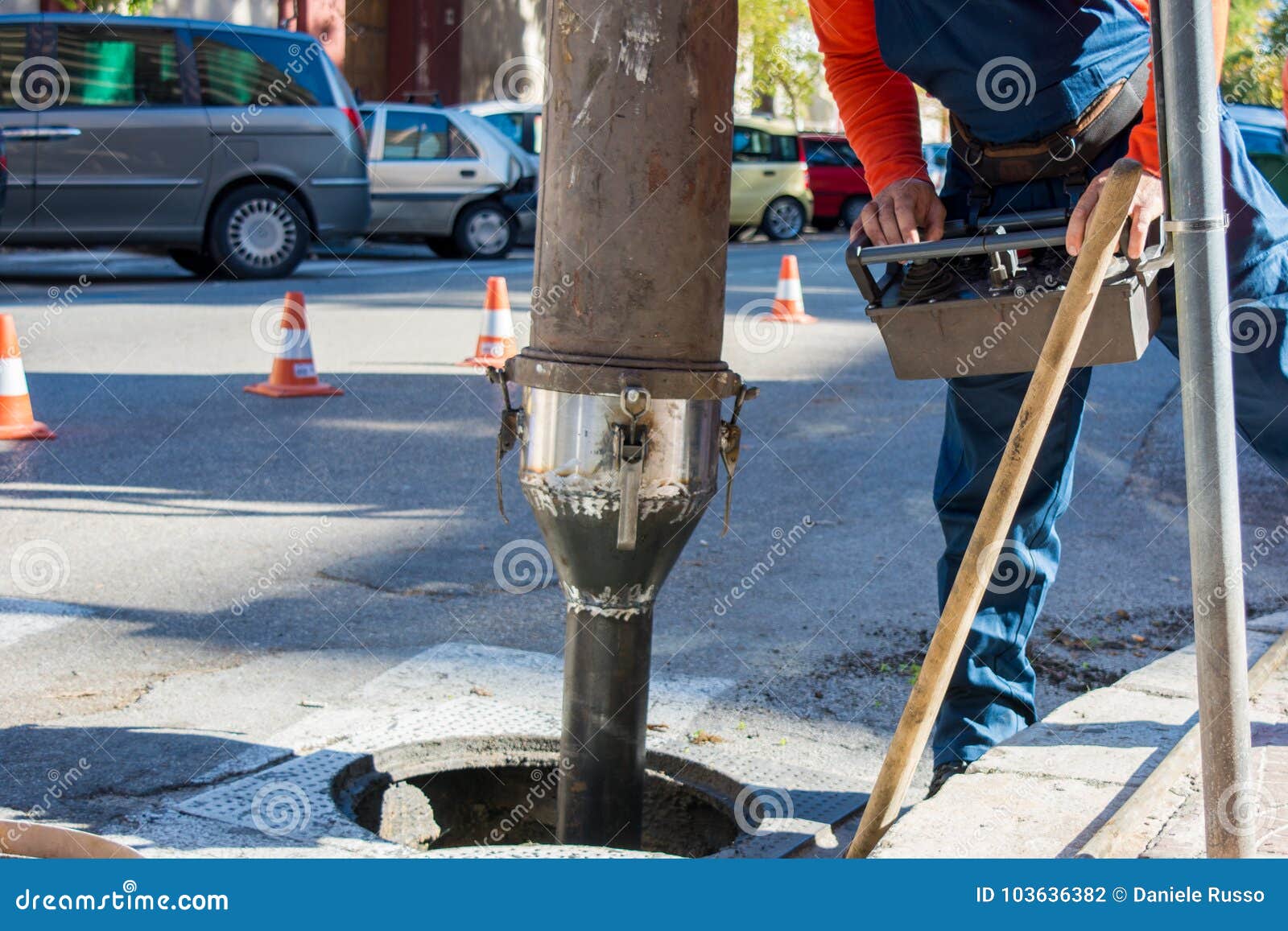 A Man is Commanding a Machine for Cleaning the Manholes in the S Stock ...
