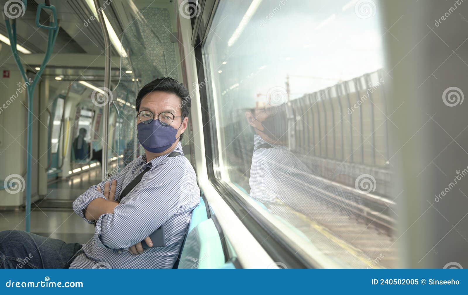 Man Commuter with Face Mask on Inside a Moving Subway Train Stock Image ...
