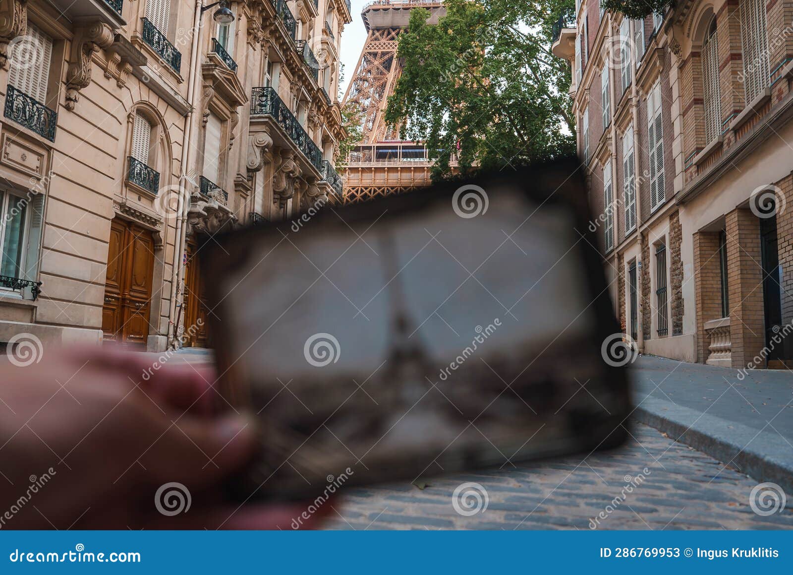 Man Comparing Old Photo with Actual Eiffel Tower Stock Image - Image of ... Man Comparing Old Photo with Actual Eiffel Tower Stock Image - Image of ...