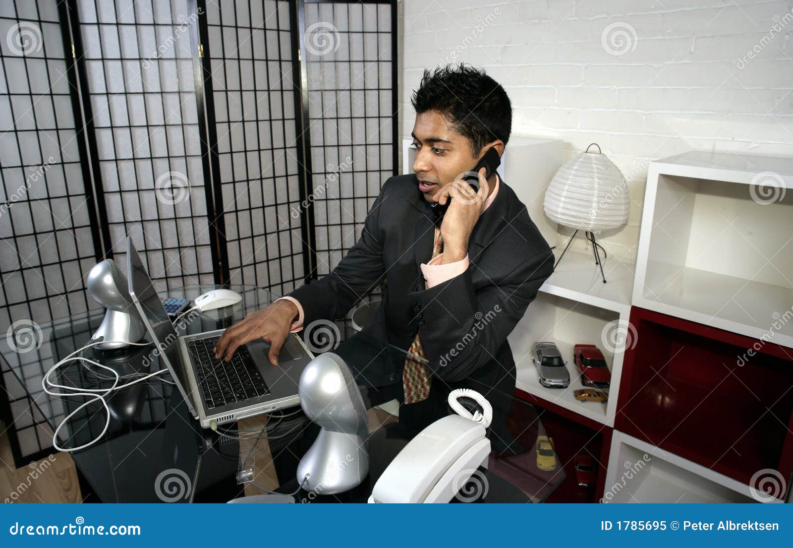 Man and computer stock image. Image of table, round, lamp - 1785695