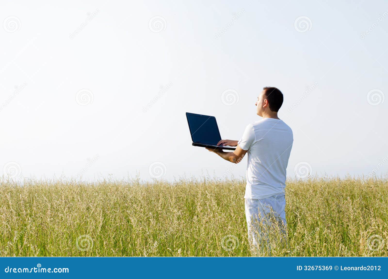 Man with Computer in the Field. Stock Image - Image of people, business ...