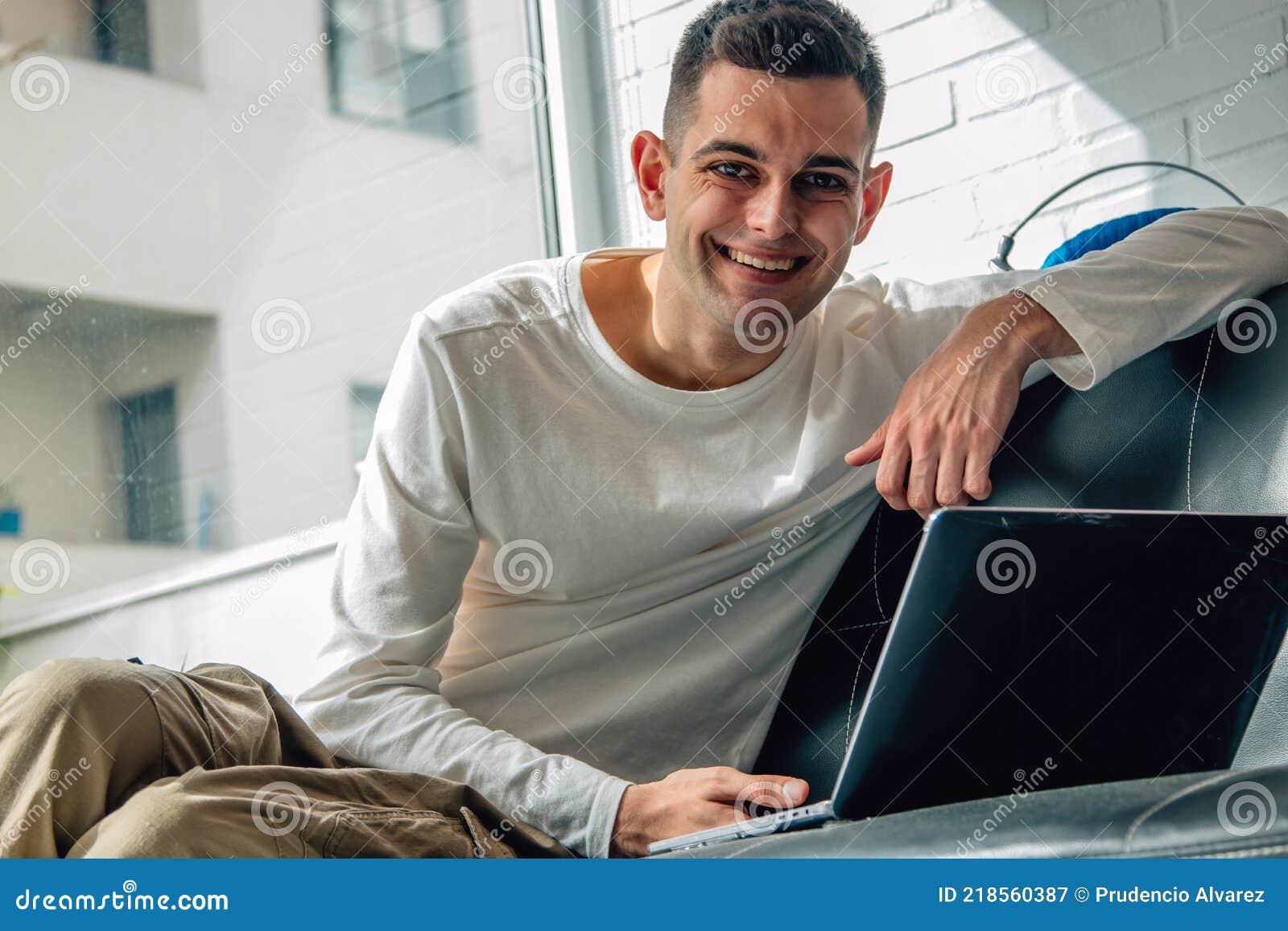 Man with computer at home stock image. Image of casual - 218560387