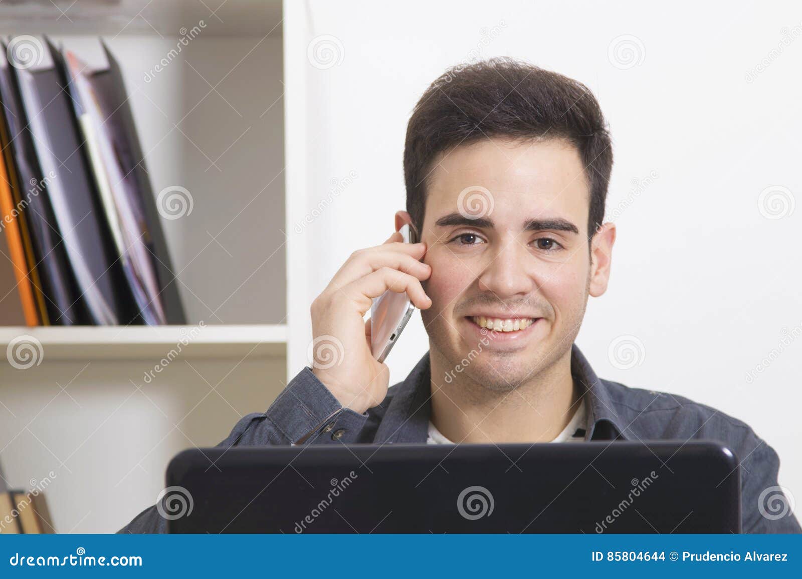 Man at Computer Talking on Phone Stock Photo - Image of technological ...