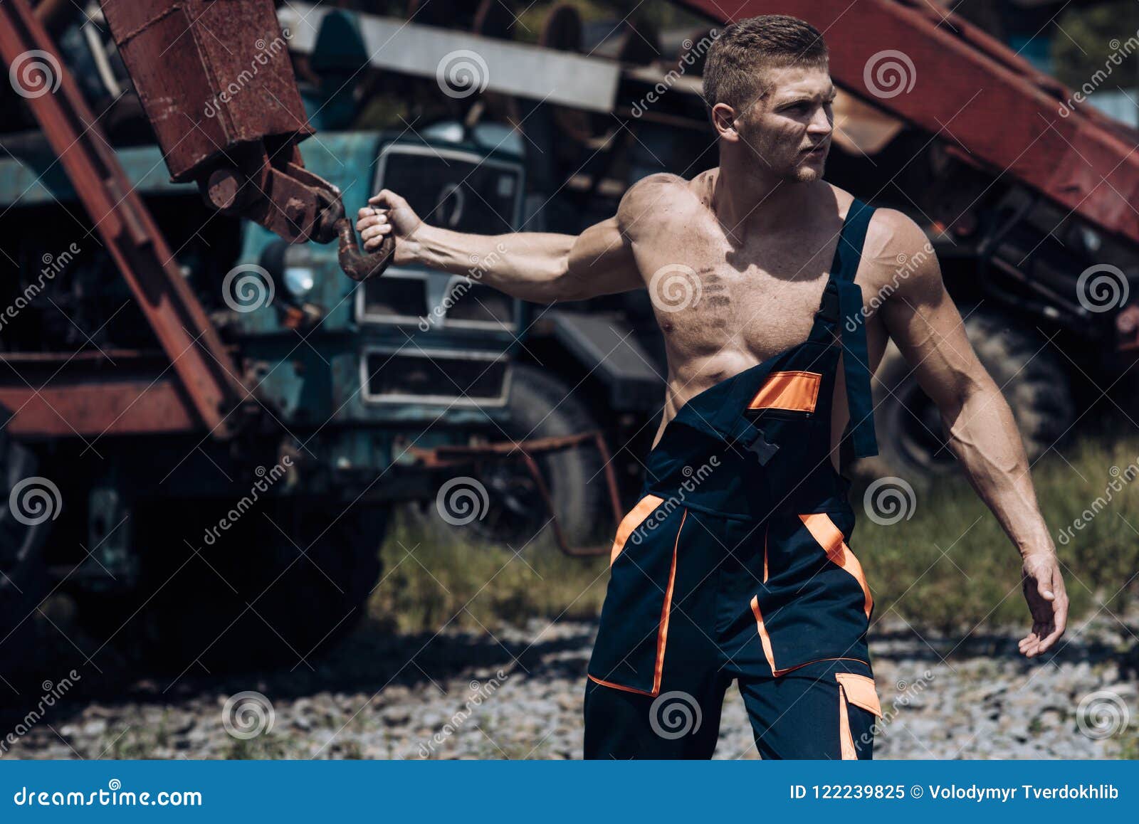 Man Concept. Strong Man Pull Heavy Iron Crane. Man of Muscle Stock ...