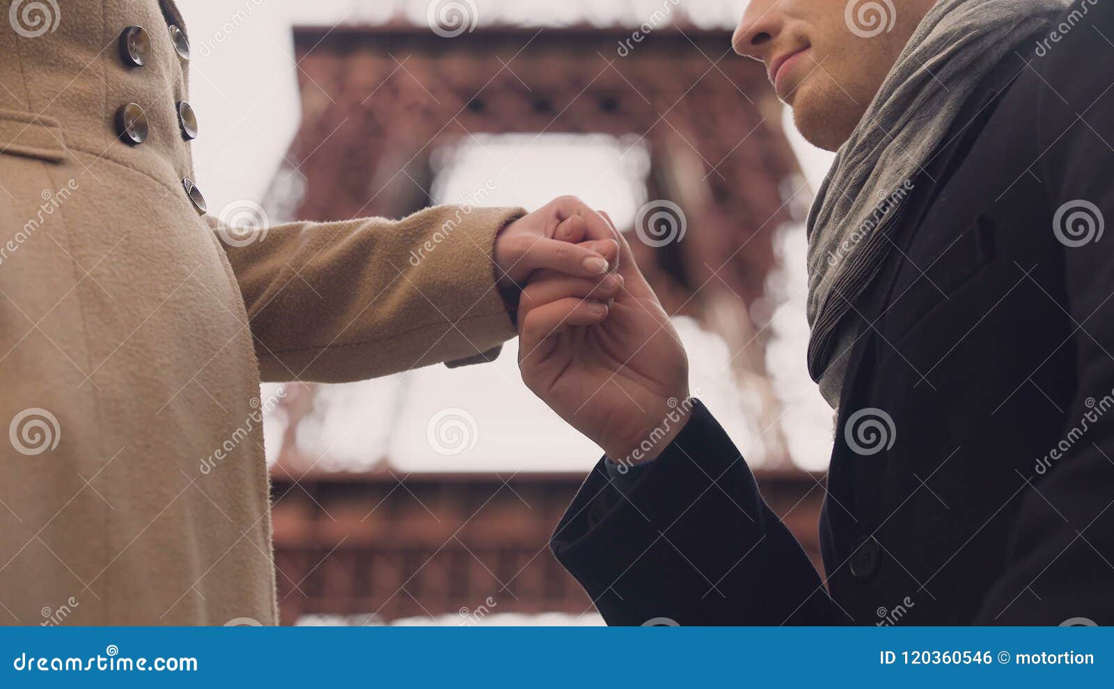 Man Confessing His Feelings And Kissing Hand To His Girlfriend Standing