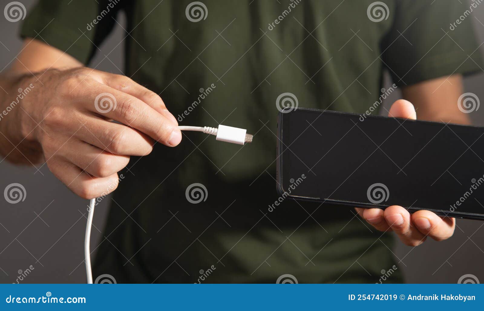 Man Connecting Charger Cable To Mobile Phone Stock Image - Image of ...