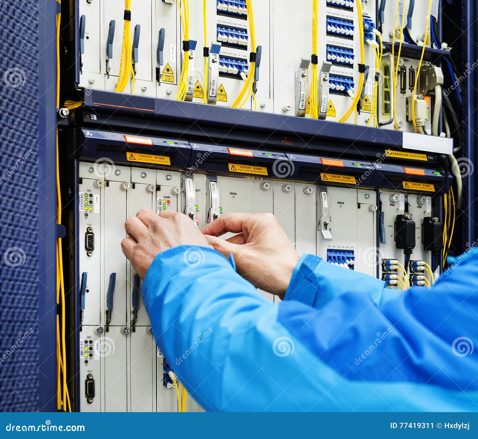Man Connecting Network Cables To Switches in the Computer Room Stock ...