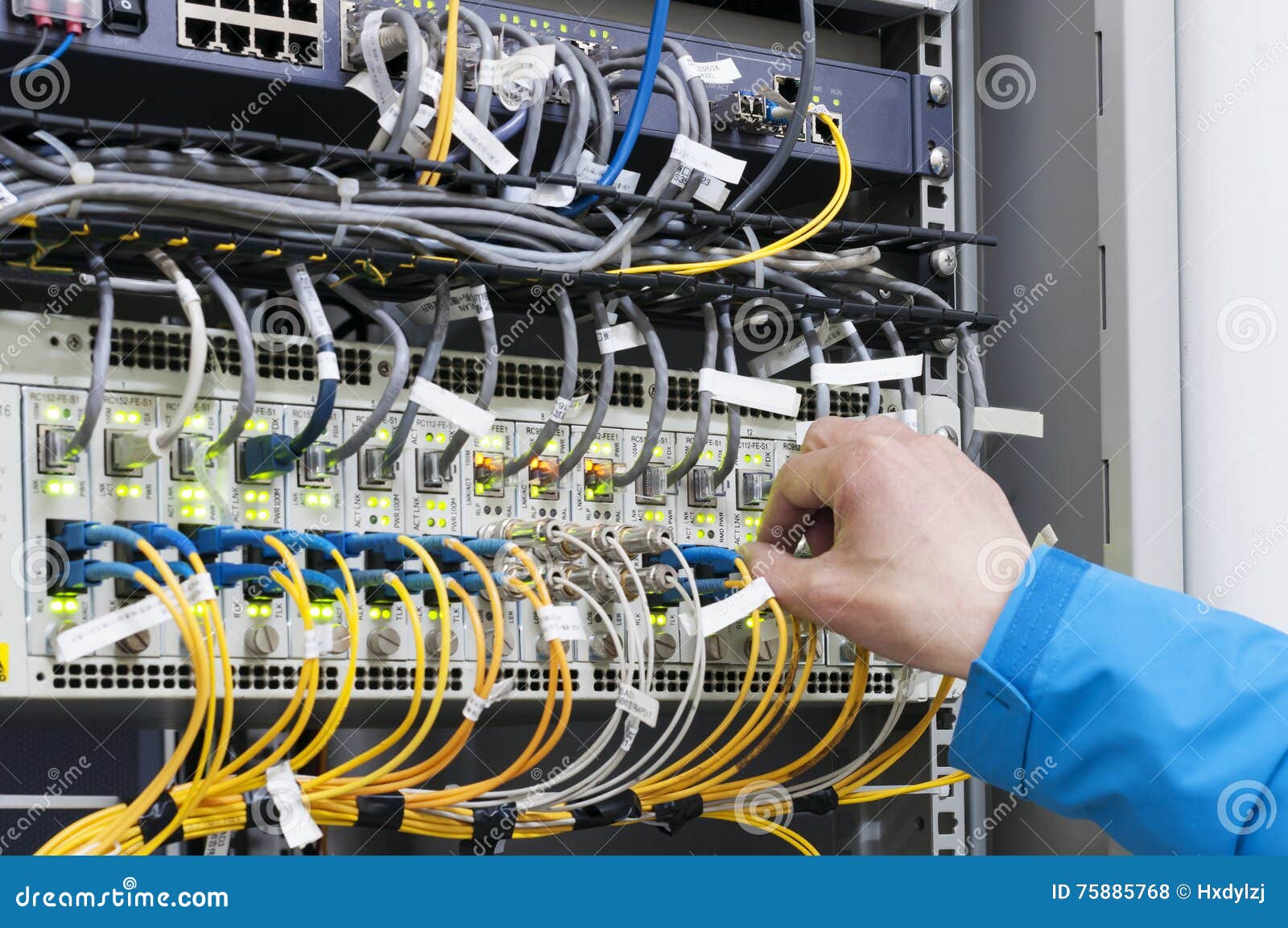 Man Connecting Network Cables To Switches Stock Photo - Image of ...