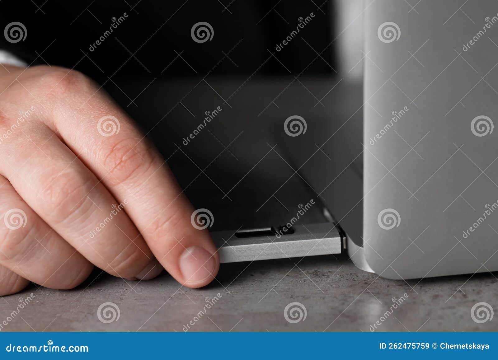 Man Connecting Usb Flash Drive To Laptop at Grey Table, Closeup Stock ...