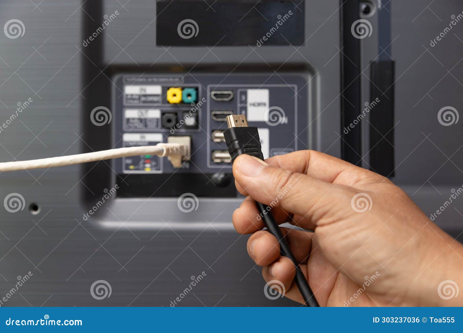 Man Connects Internet Cable To the TV Stock Photo - Image of wire, side ...