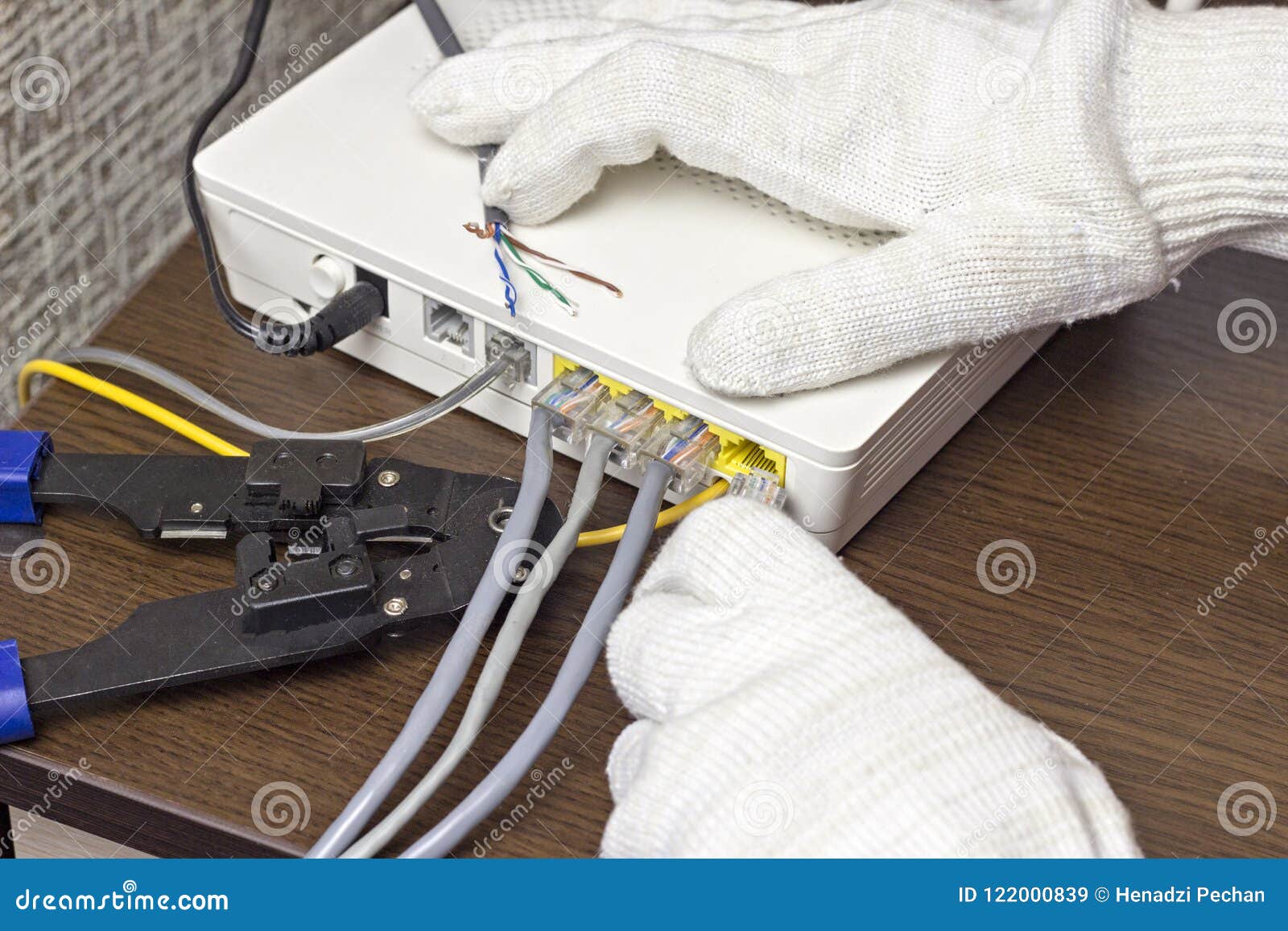 A Man Connects a Network Cable To the Modem, a Close-up Stock Image ...