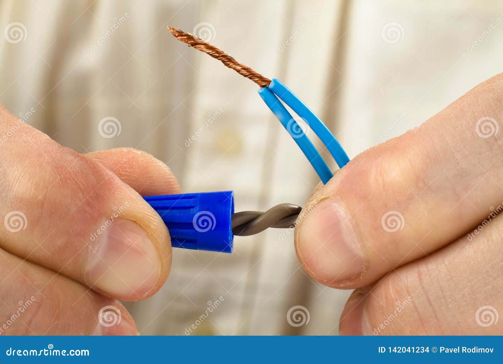 Man Connects the Twisted Ends of the Wires Using Cone Connector Stock ...