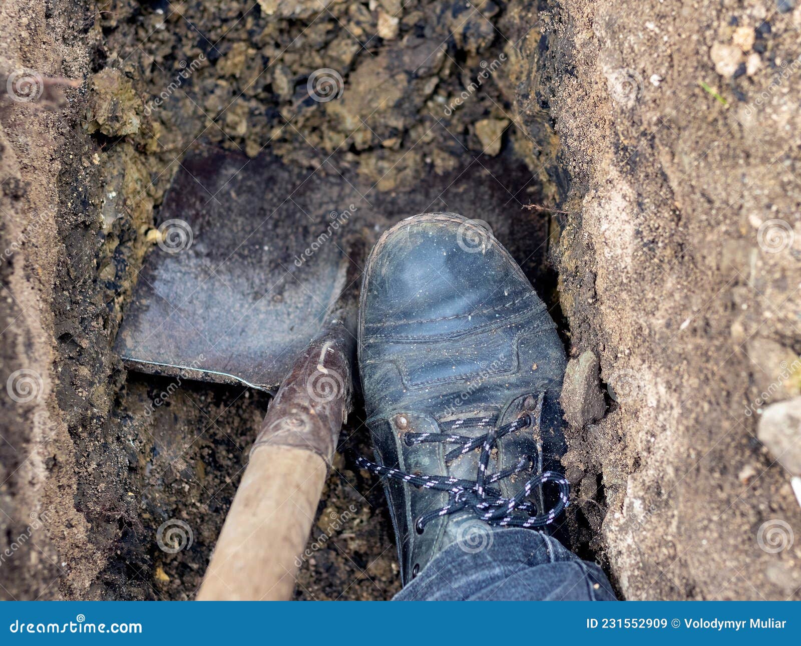 A Man on a Construction Site Digs a Ditch with a Shovel Stock Image ...