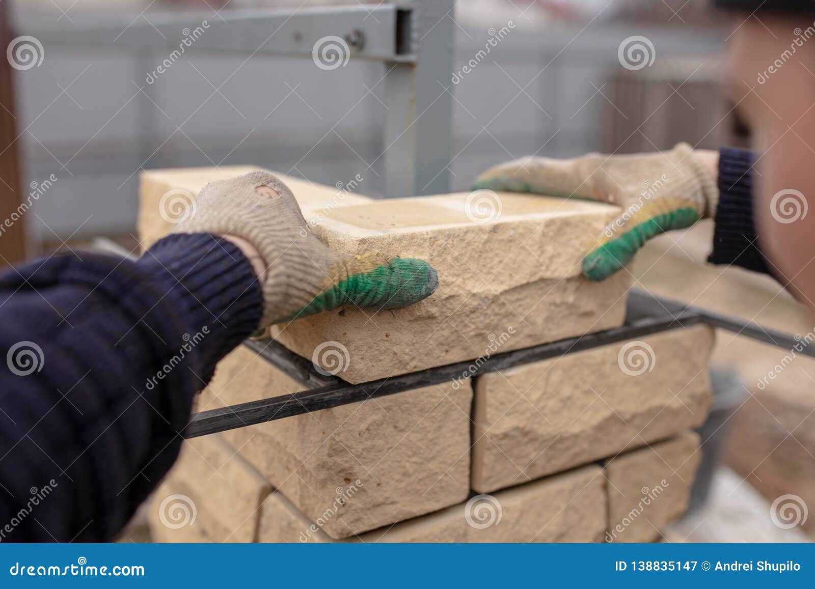 The Man at the Construction Site is Laying Bricks Stock Image - Image ...