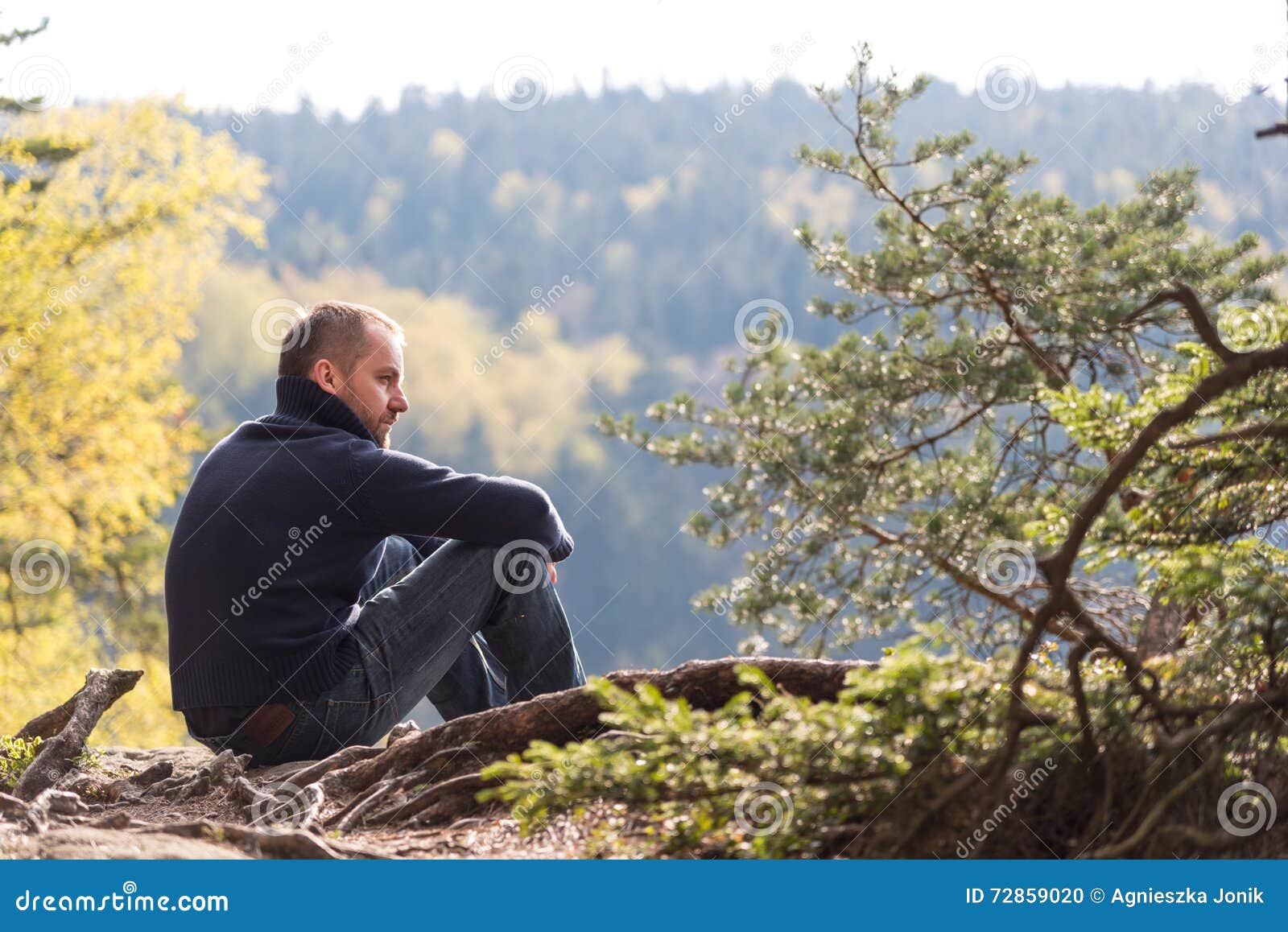 Man Contemplating in Mountains Stock Photo - Image of stone, peaceful ...