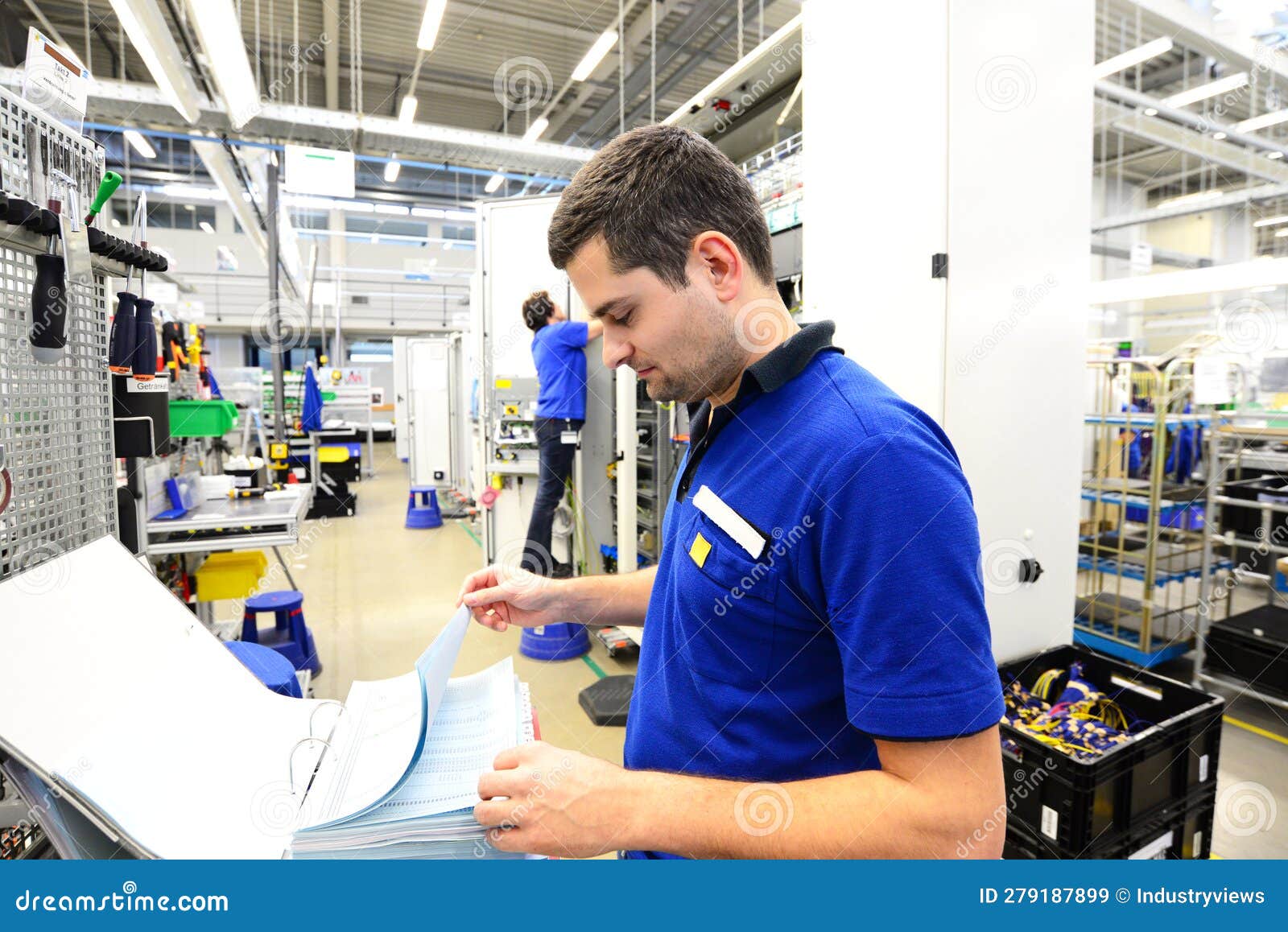 Man Controlled Assembly Instructions, in the Background Mounted a Woman ...