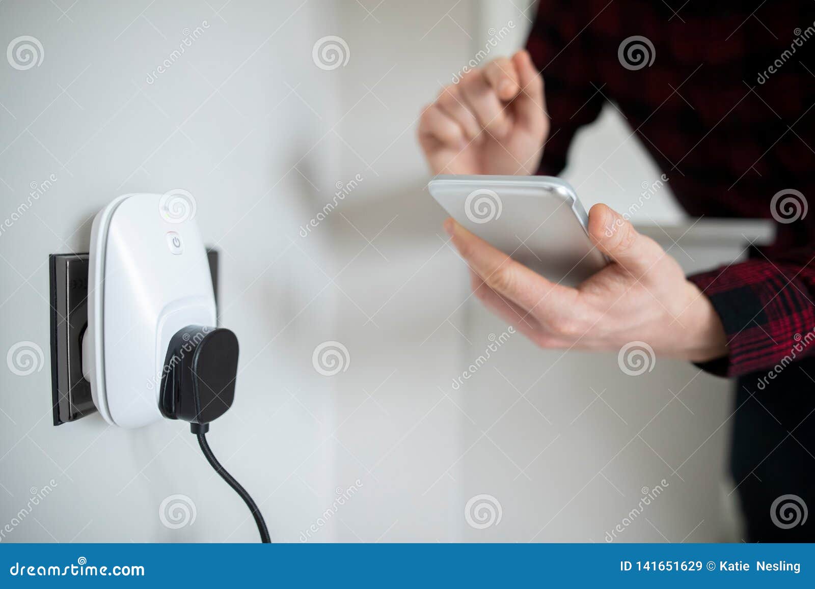 Man Controlling Smart Plug Using App on Mobile Phone Stock Image ...