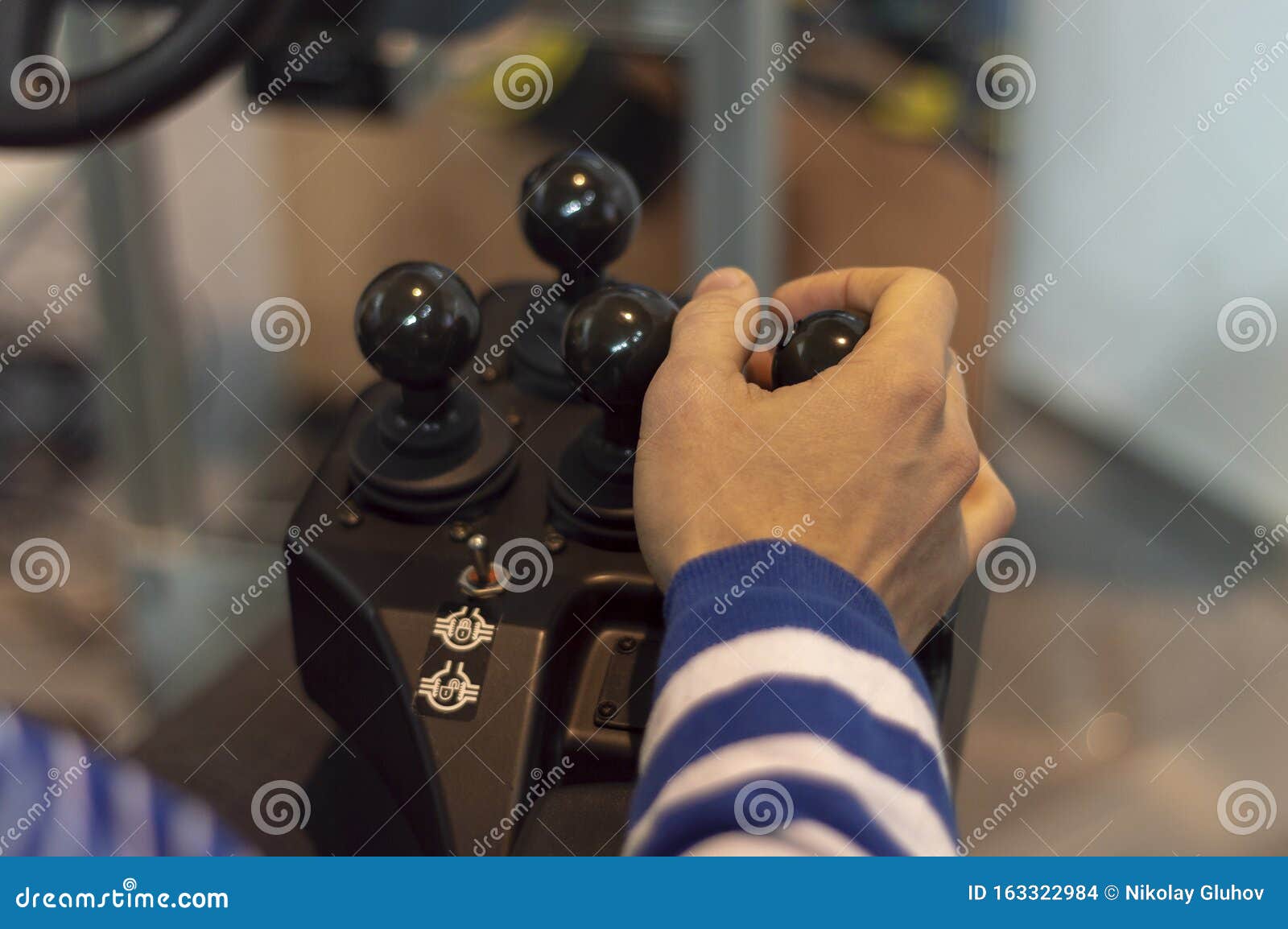 A Man Controls Tractor Simulator - an Excavator. Stock Photo - Image of ...