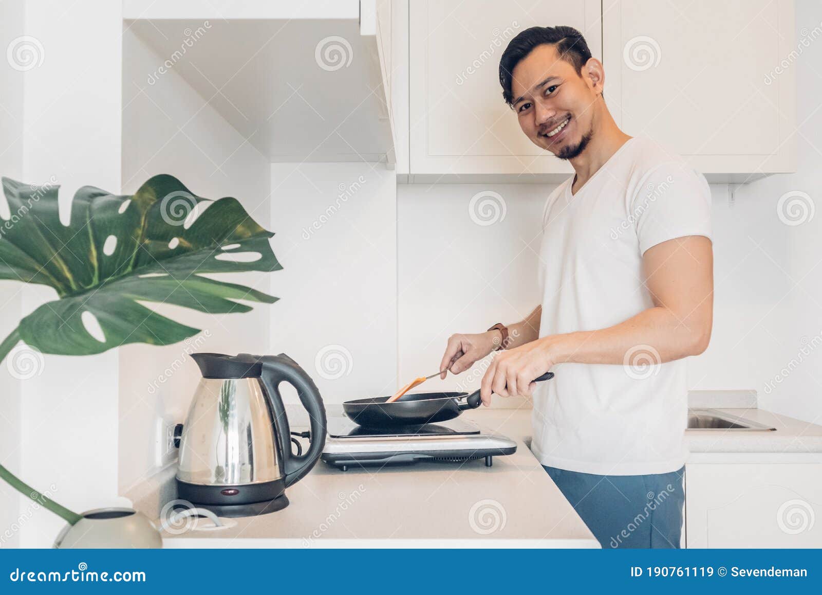 Man is Cooking Breakfast in the Kitchen. Stock Image - Image of happy ...