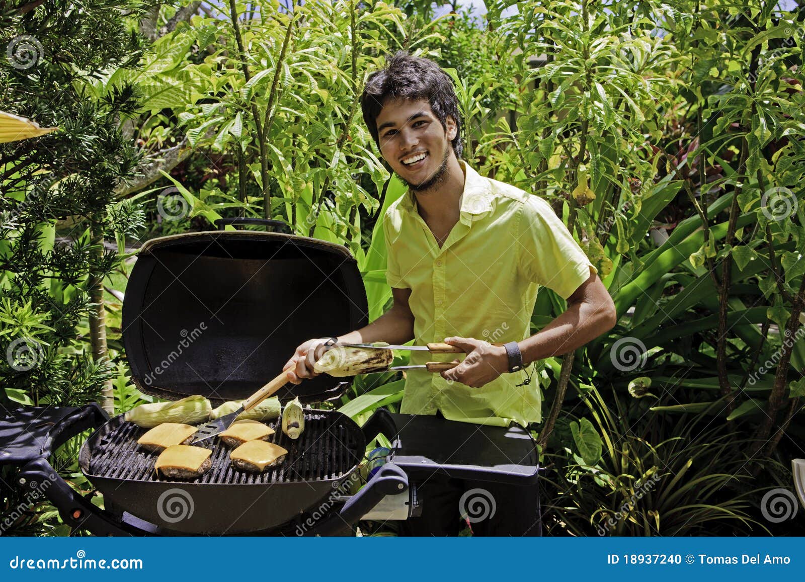 Man Grilling Hamburgers