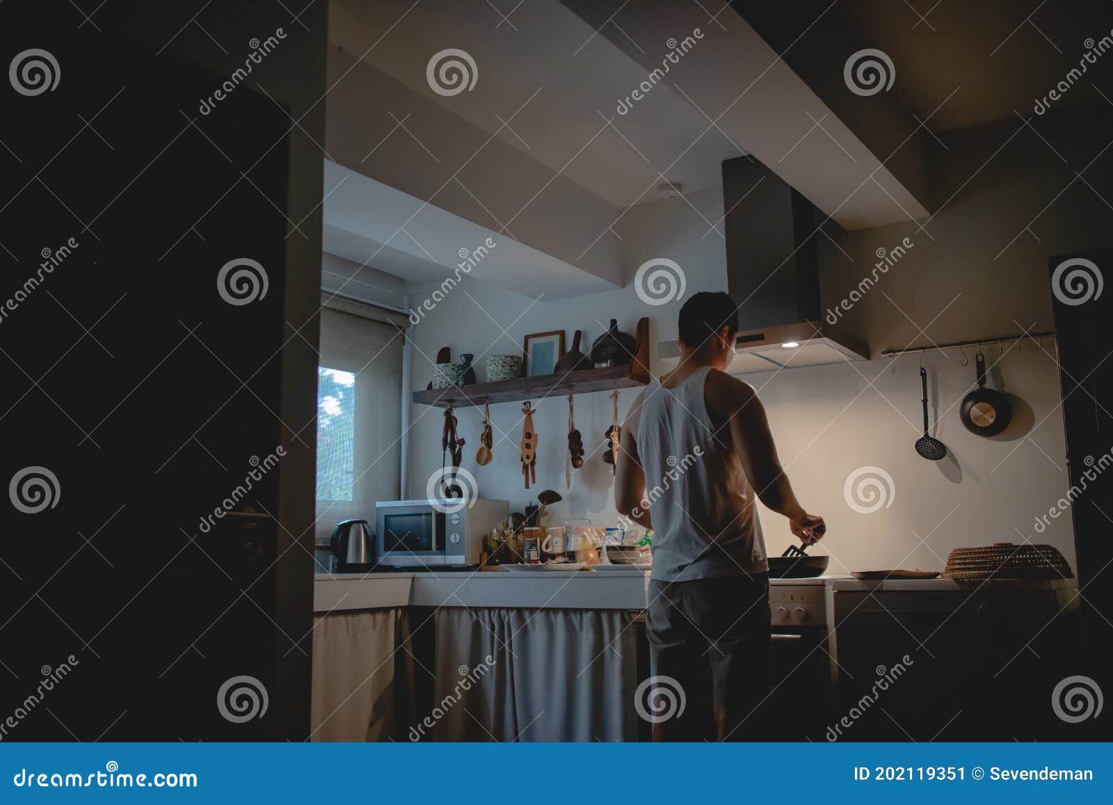 Man is Cooking Dinner in the Kitchen. Stock Image - Image of interior ...
