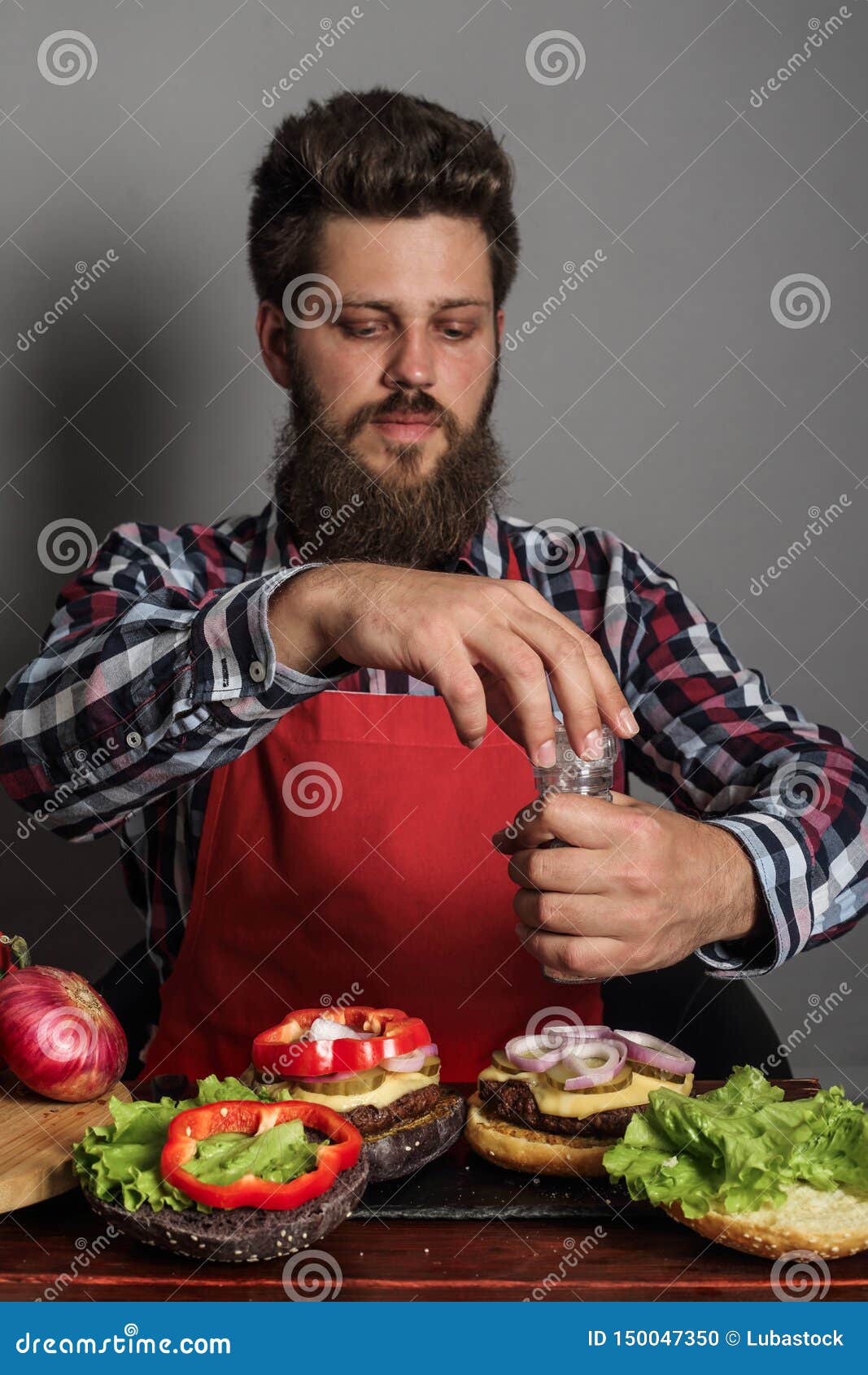 Man cooking burger stock photo. Image of beef, cooking - 150047350