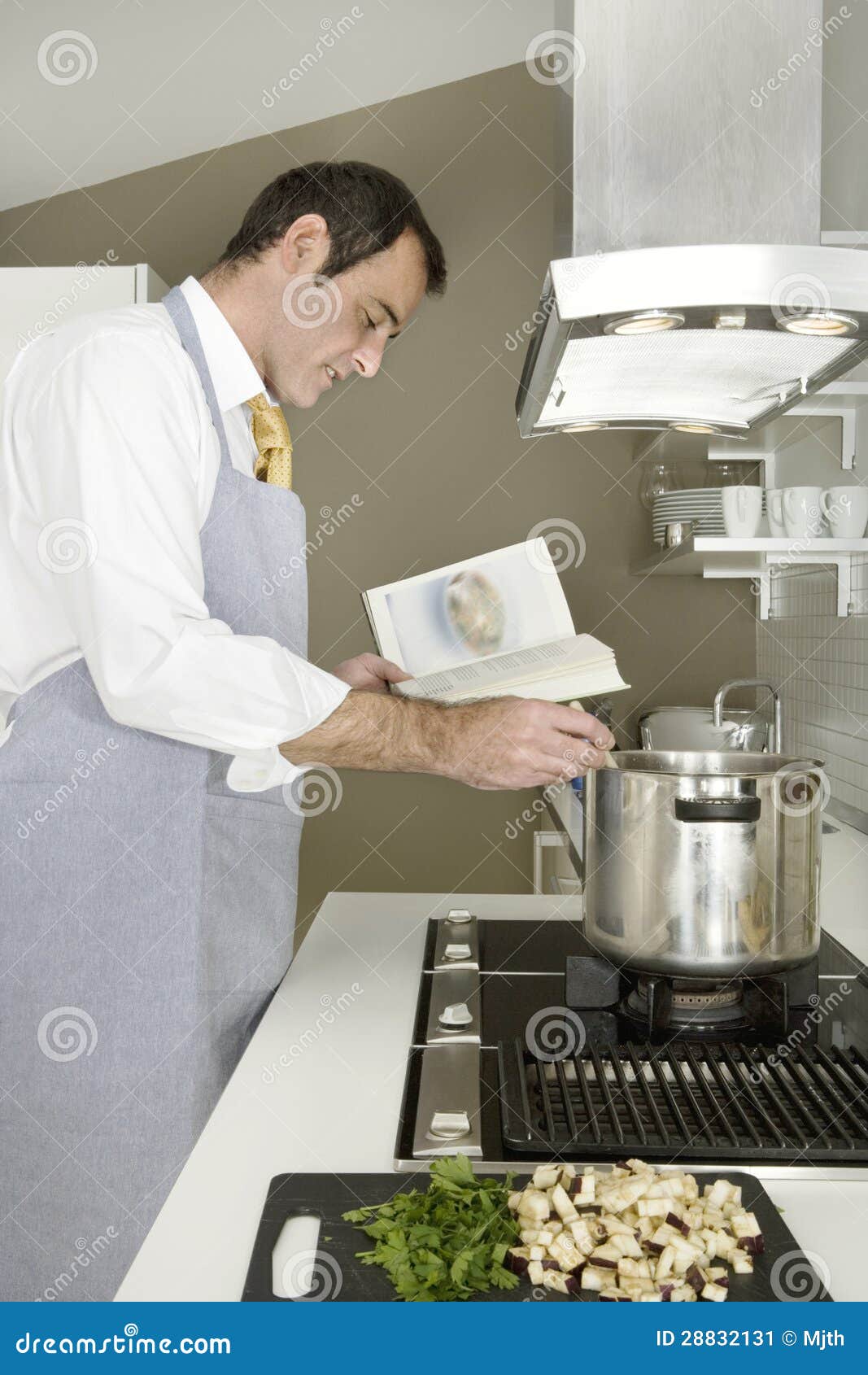 Man Cooking at HOme stock image. Image of indoors, duties - 28832131