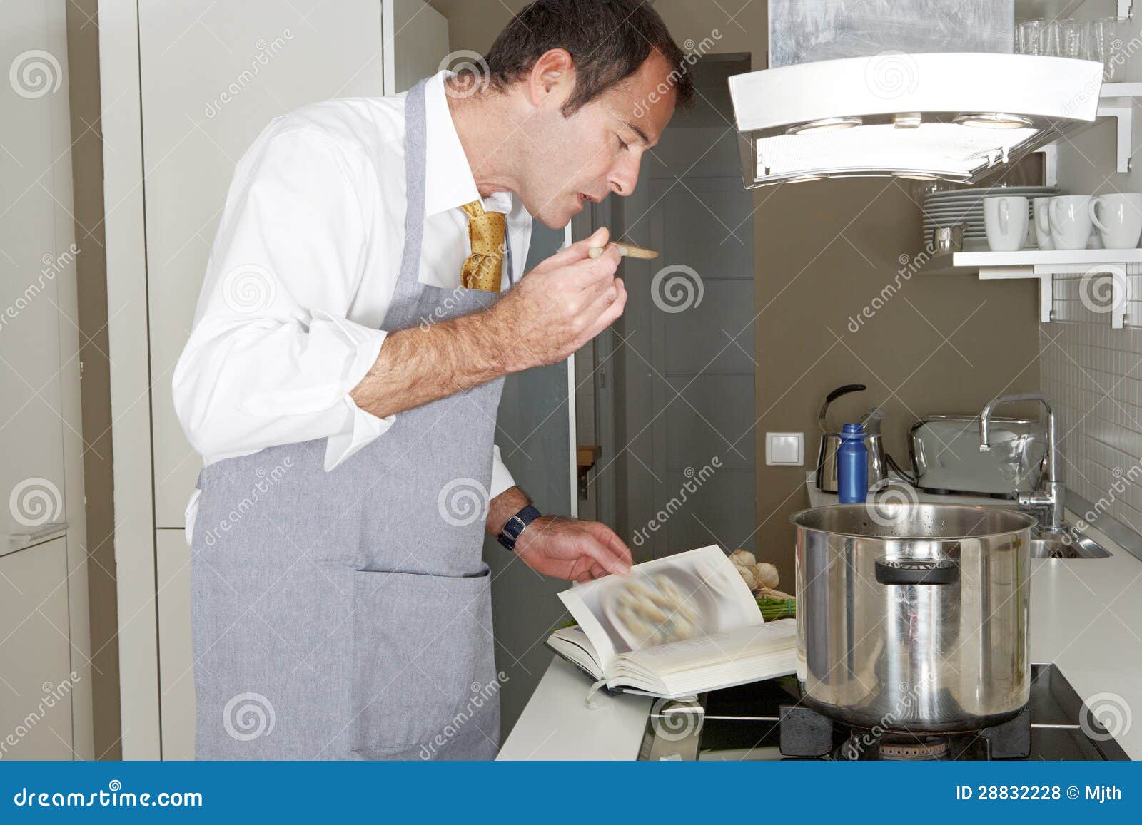 Man Cooking at Home stock photo. Image of homework, food - 28832228