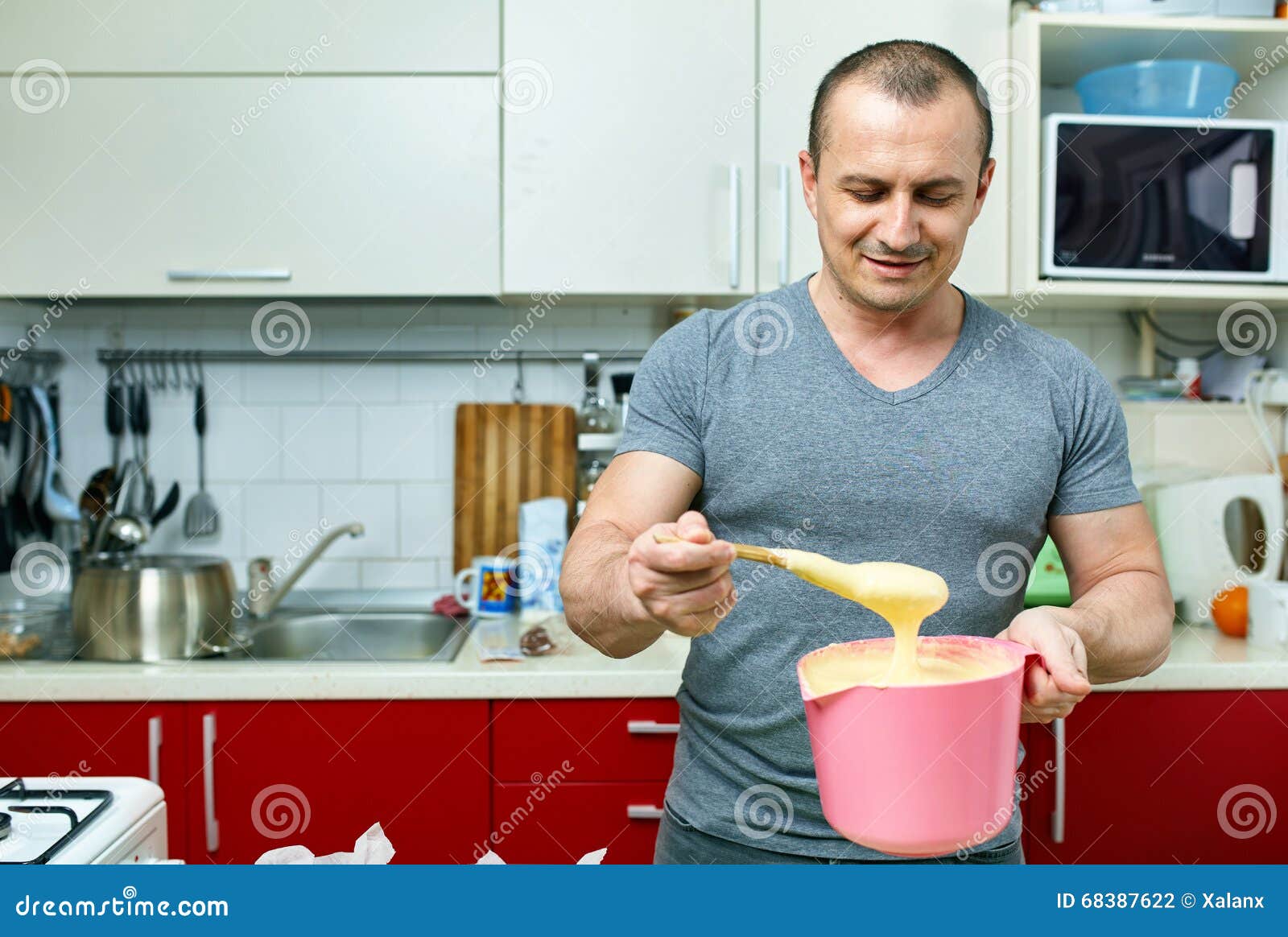 Man cooking at home stock photo. Image of adult, bakery - 68387622