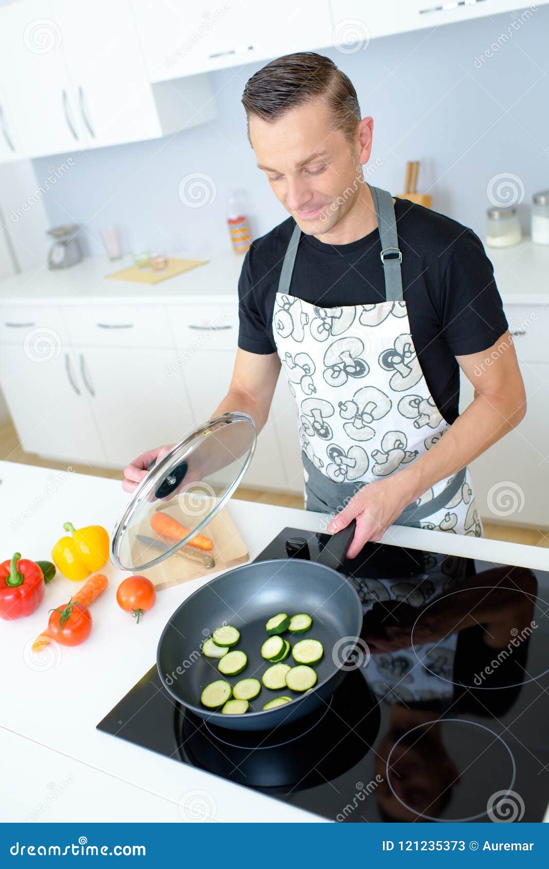 Man Cooking at Home in Kitchen Stock Image - Image of focus, lifestyle ...