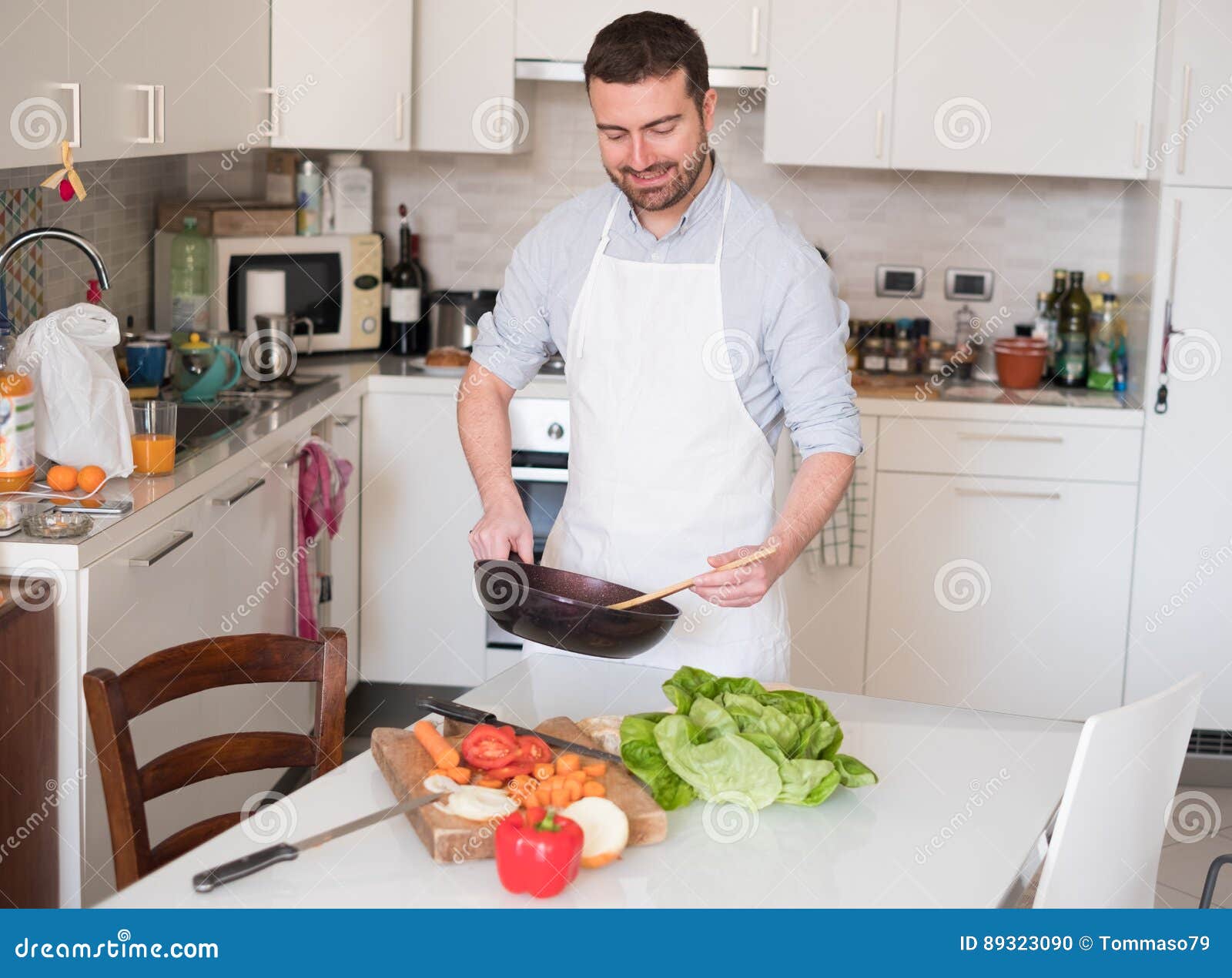 Man Cooking at Home and Preparing Food Stock Photo - Image of clothes ...