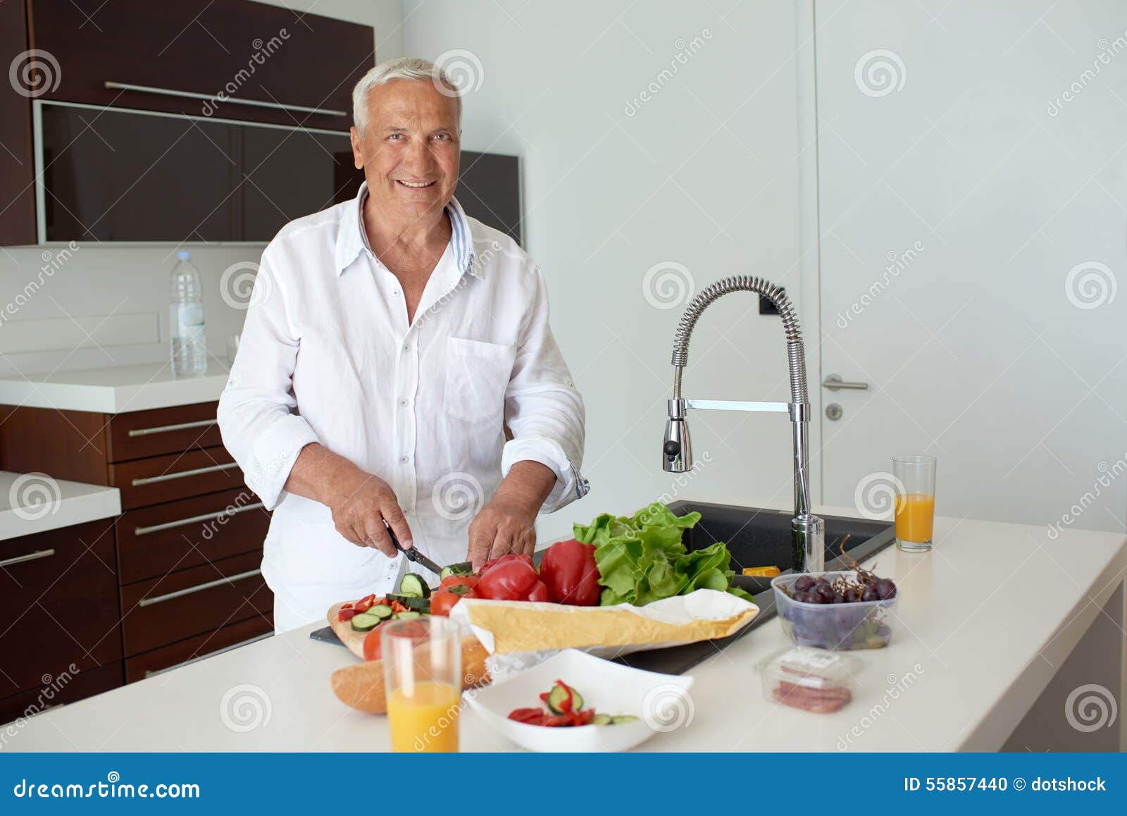 Man Cooking at Home Preparing Salad in Kitchen Stock Photo - Image of ...