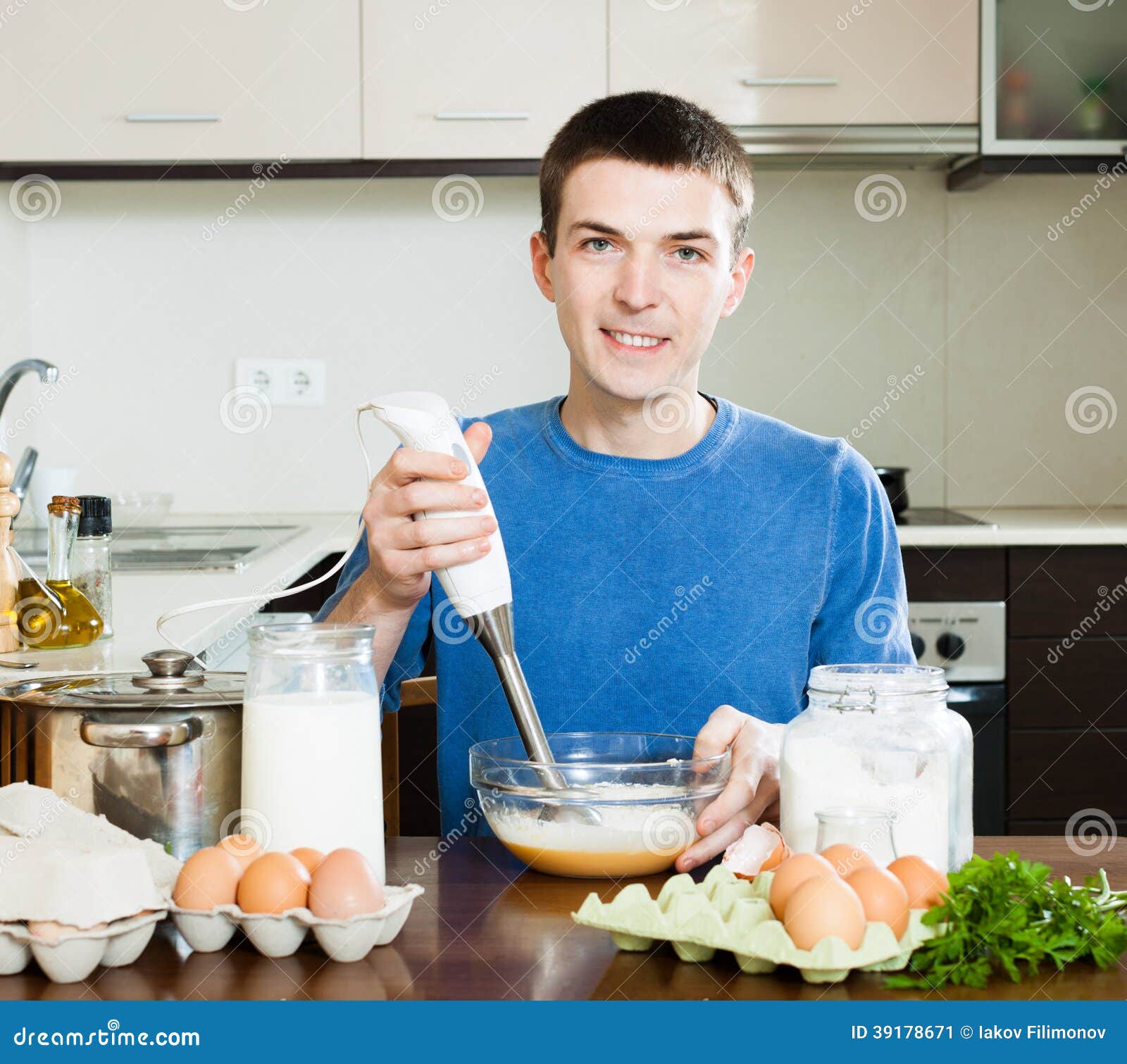 Man cooking in kitchen stock image. Image of holding - 39178671
