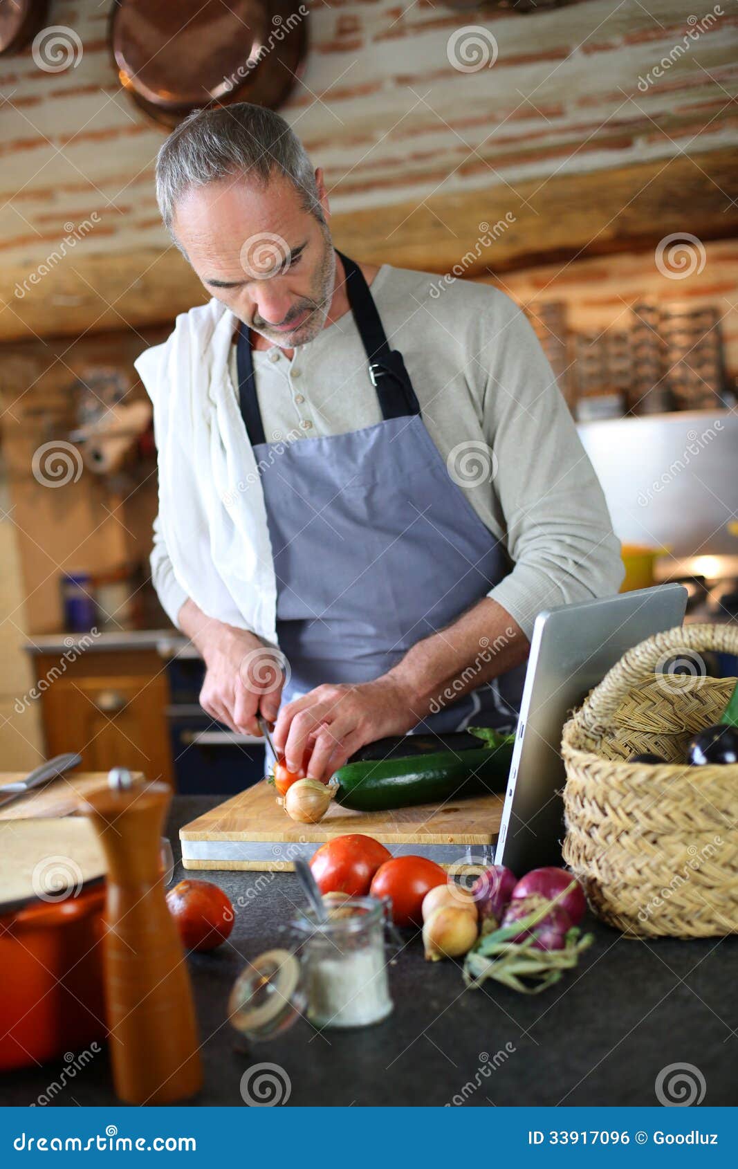 Man Cooking in Kitchen with Help of Tablet Stock Photo - Image of ...