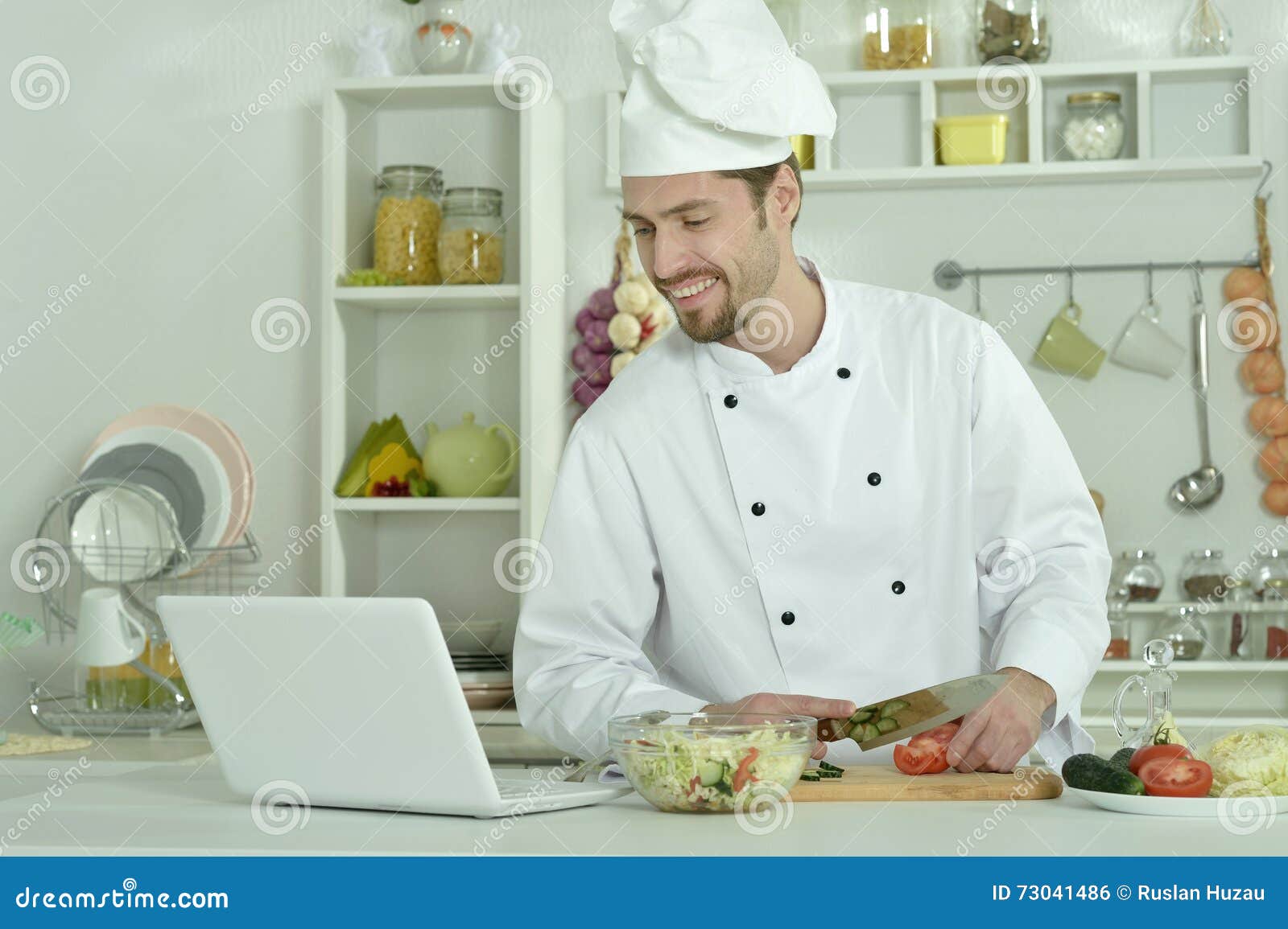 Man cooking in kitchen stock photo. Image of cooking - 73041486
