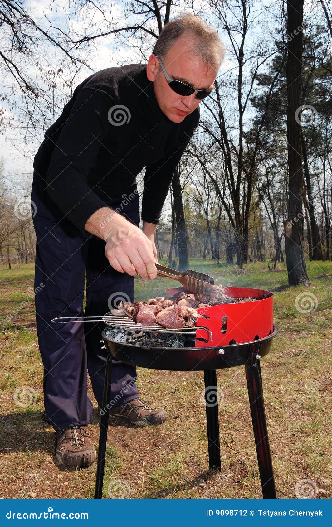 Man cooking meat stock photo. Image of dinner, kitchenware - 9098712