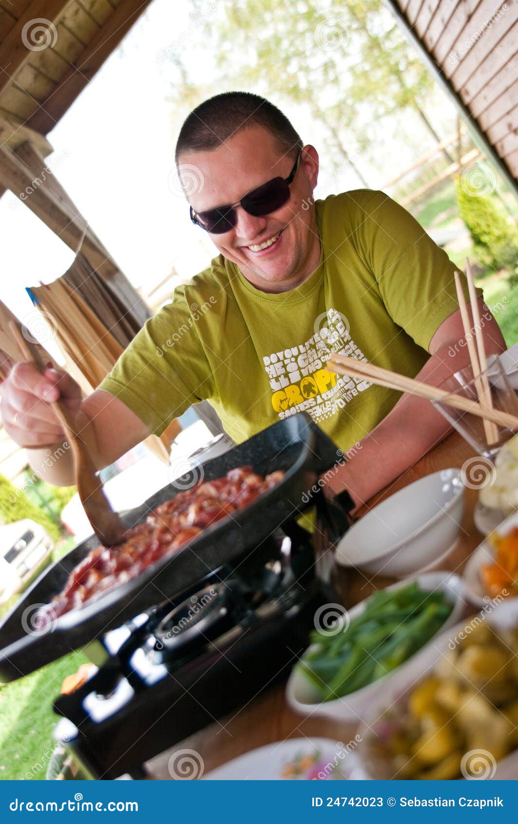Man Cooking Outdoors Asian Style Food, Korean Meat on the Portable ...