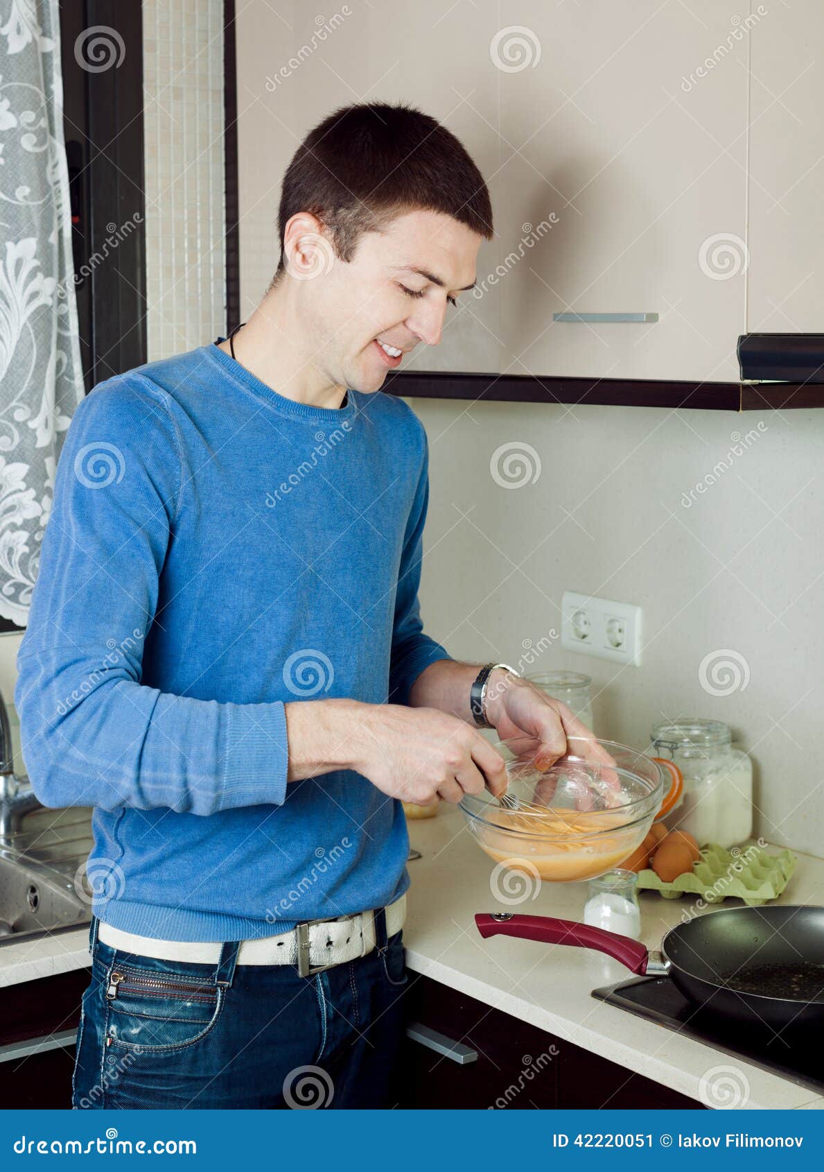 Man cooking scrambled eggs stock image. Image of meal - 42220051