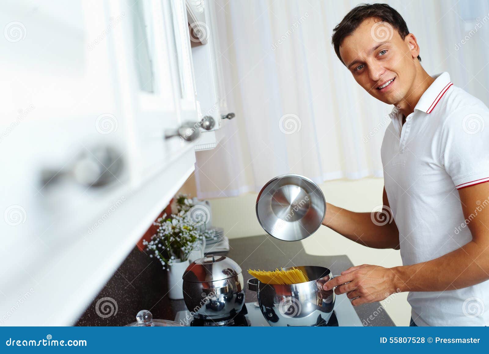 Man cooking spaghetti stock photo. Image of caucasian - 55807528