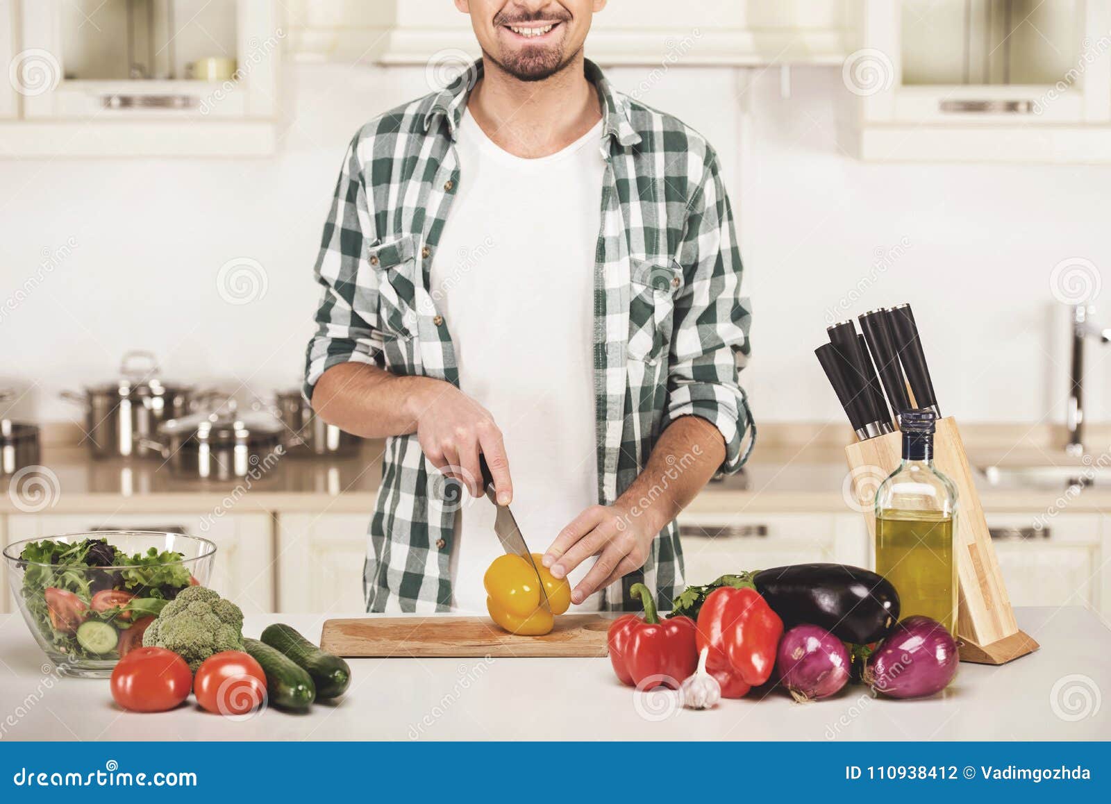 Man is Cooking Vegetable Salad in the Kitchen Stock Photo - Image of ...