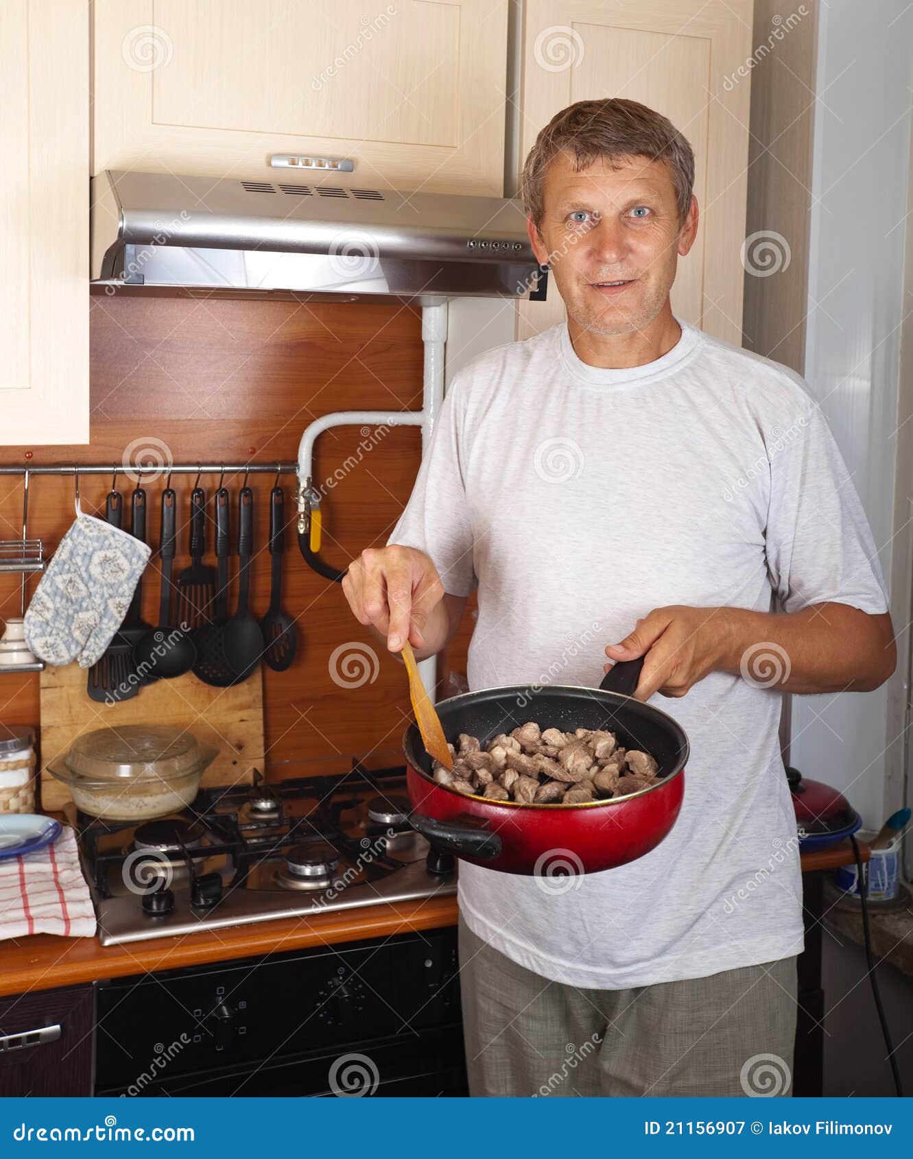 Man cooks meat stock image. Image of dish, brown, indoor - 21156907