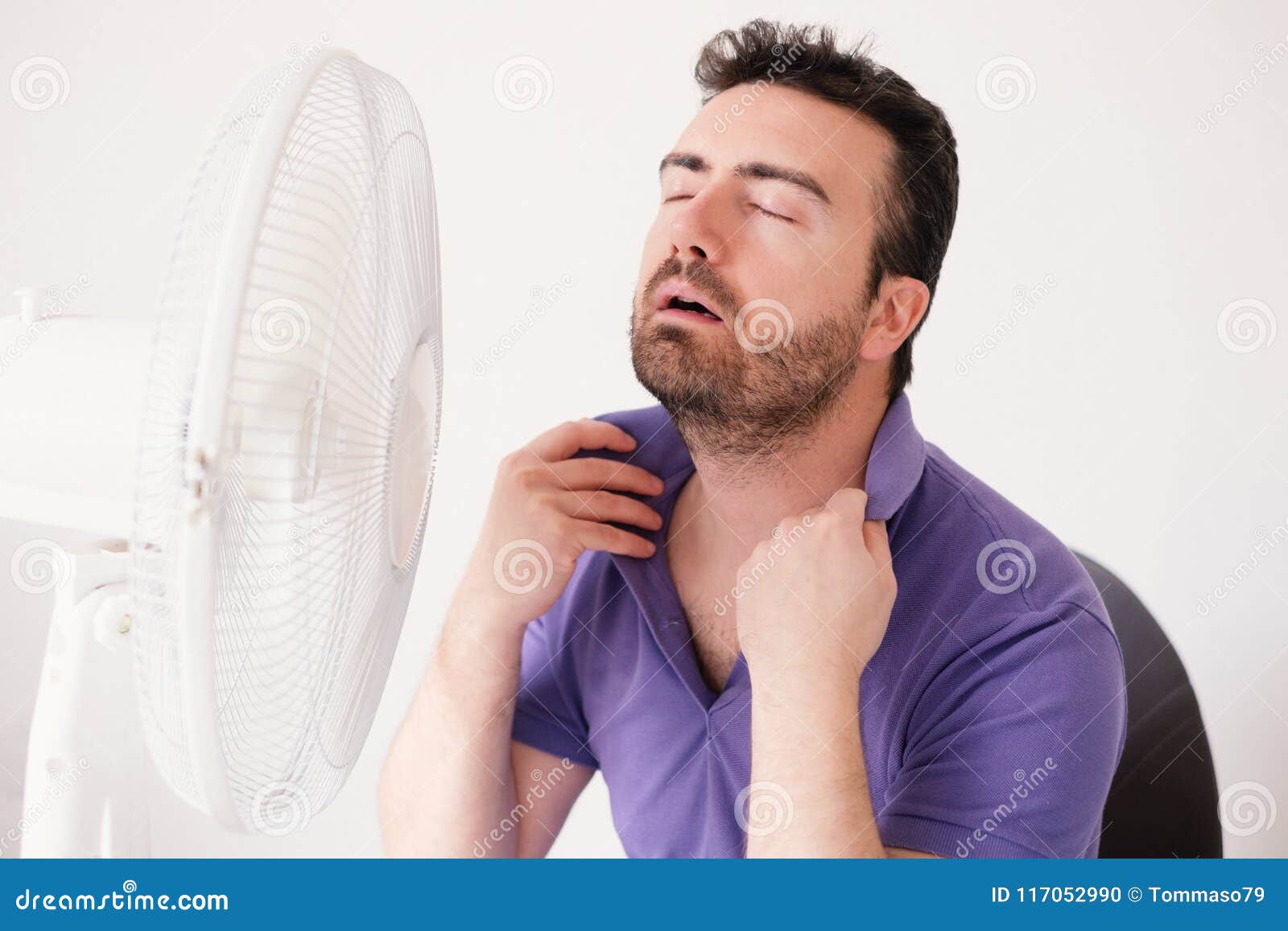 Man Cooling in Front of Air Electric Fan Stock Photo - Image of ...