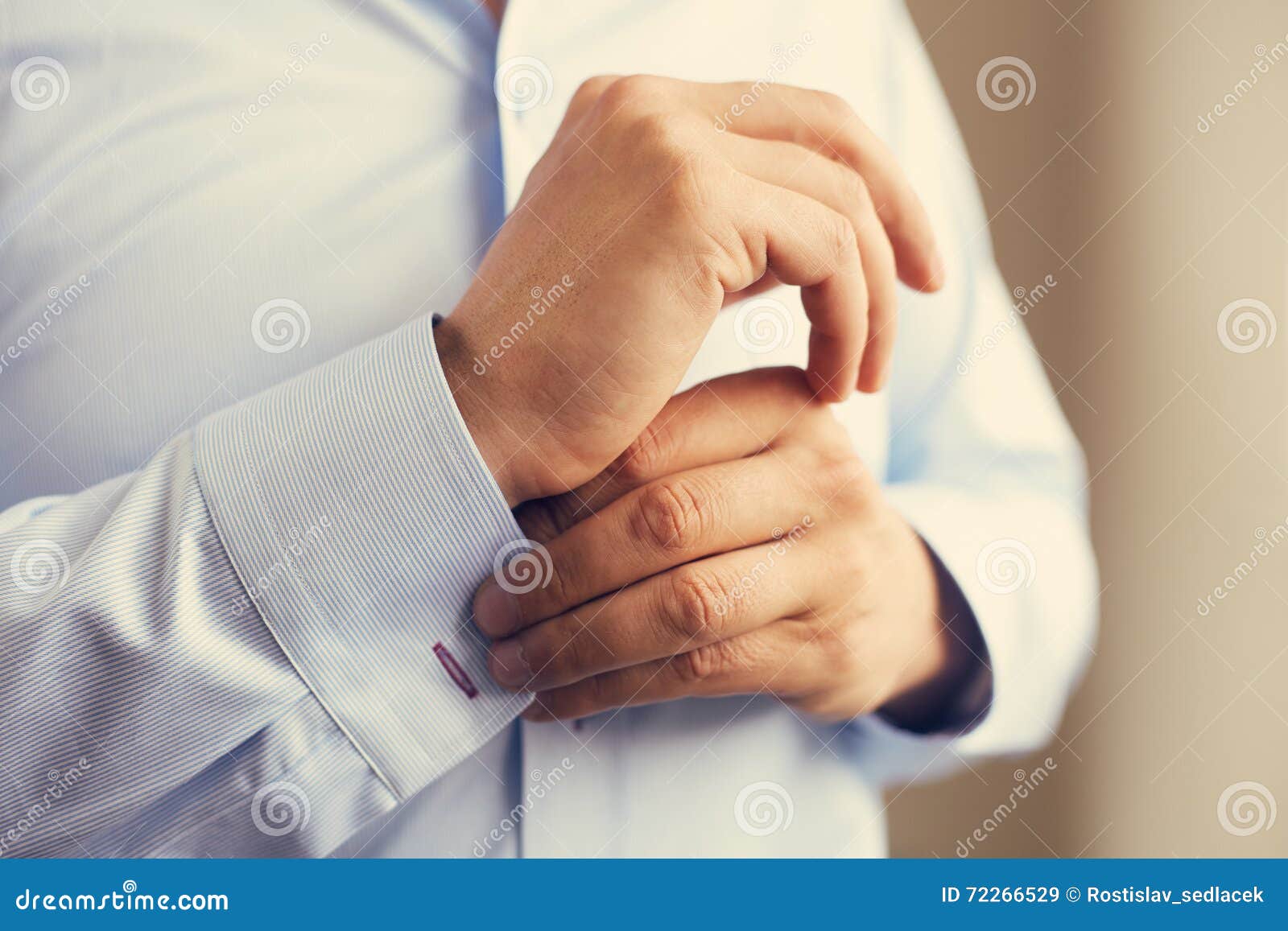 Man Correcting the Sleeve of His Shirt Stock Image - Image of wedding ...